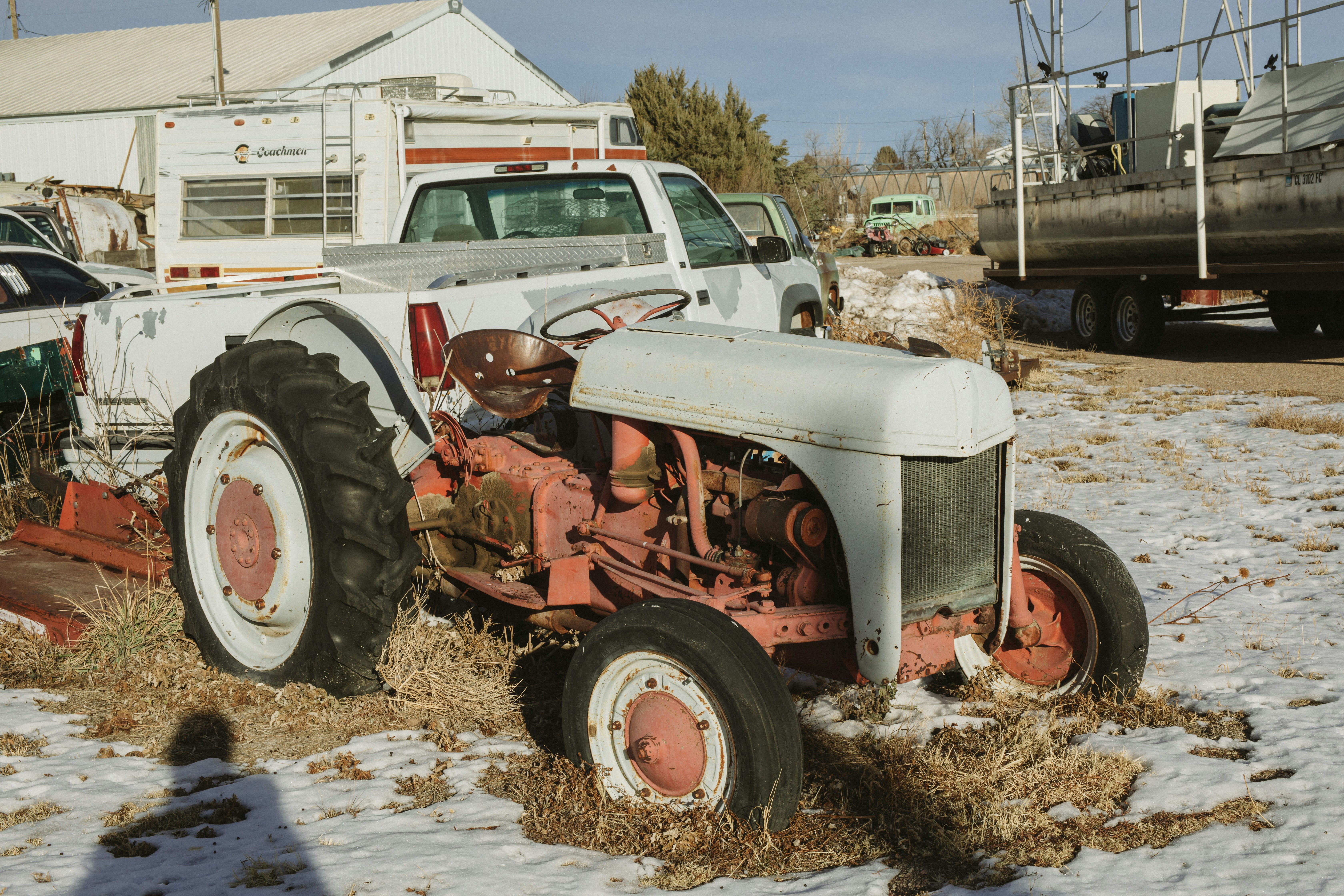 Red and white tractor on brown field during daytime photo – Free Nature ...