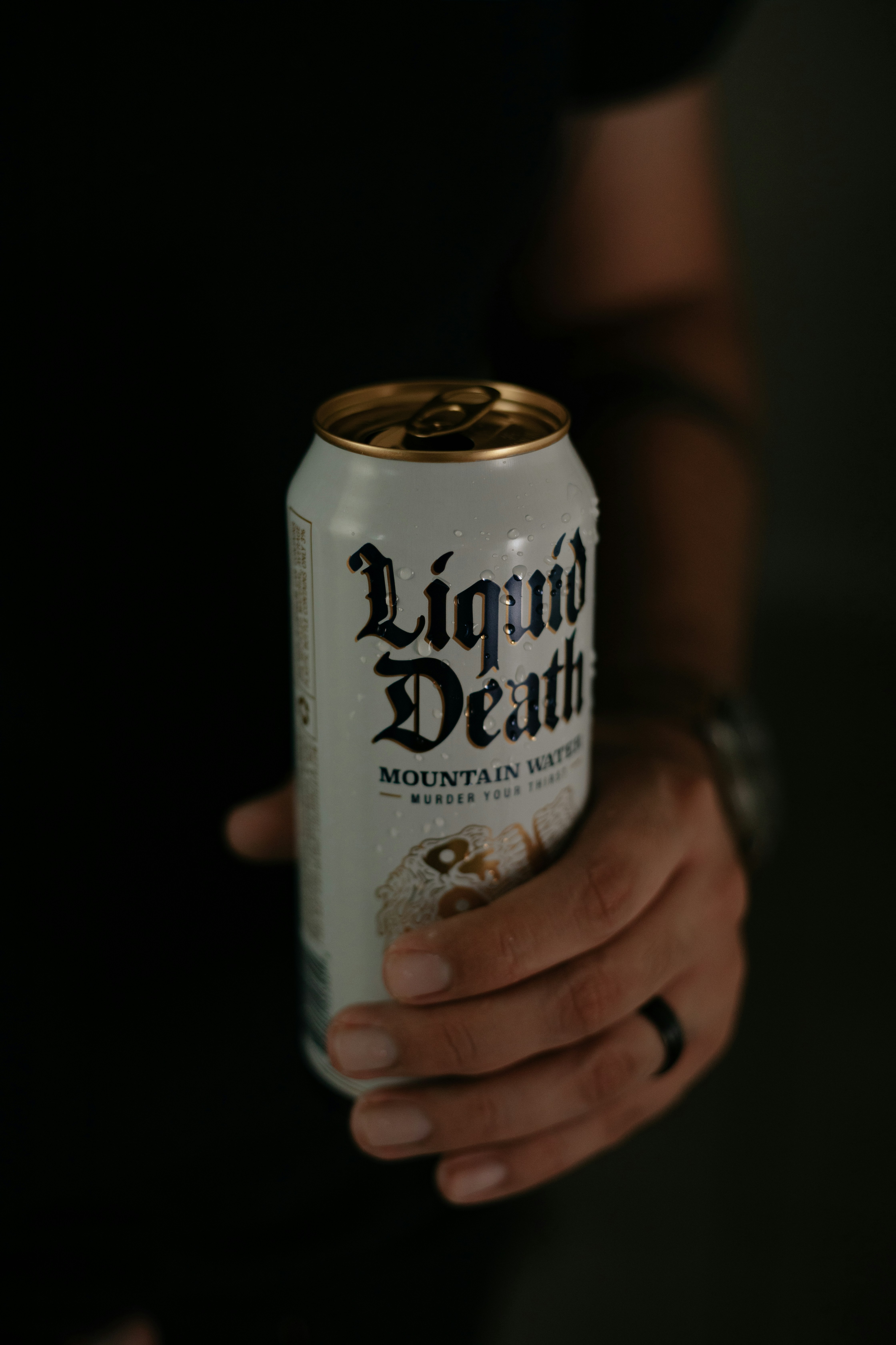 Low-Key Moment: A Liquid Death Can Gripped by Dim Light