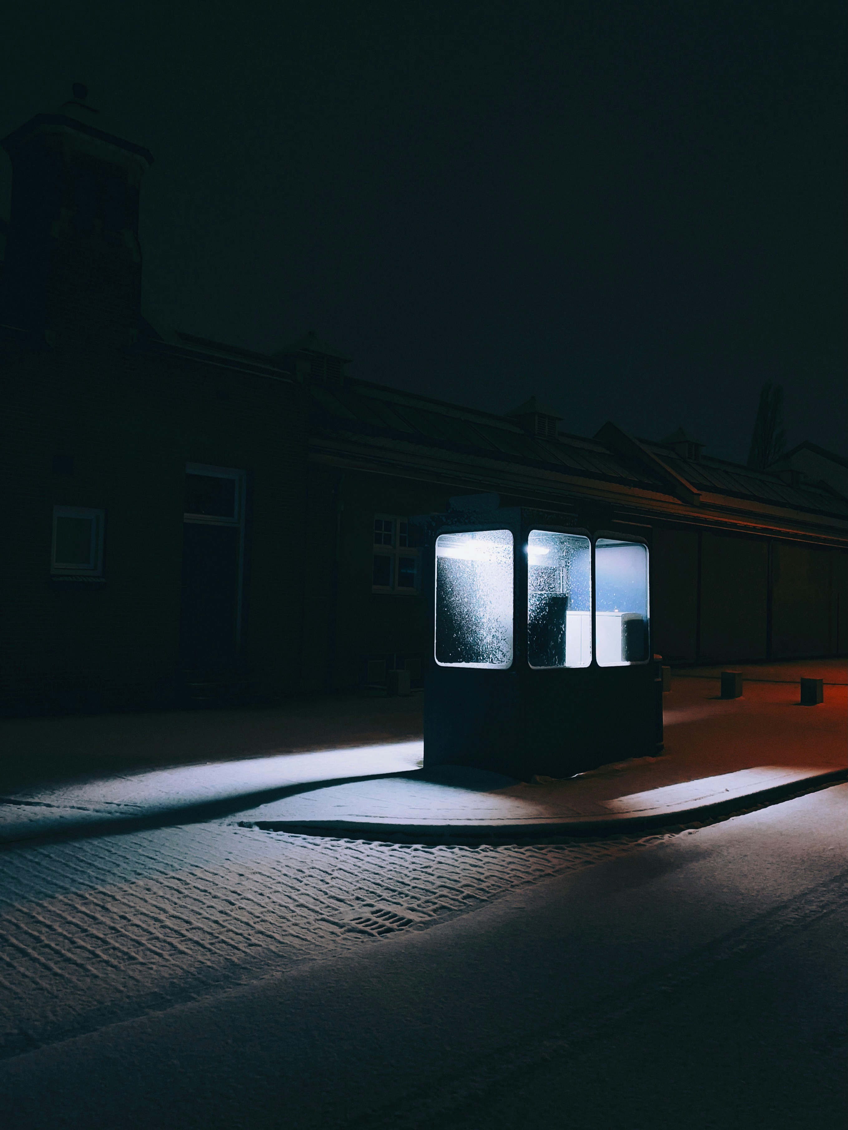 The Quiet Glow of a Snowlit Bus Stop
