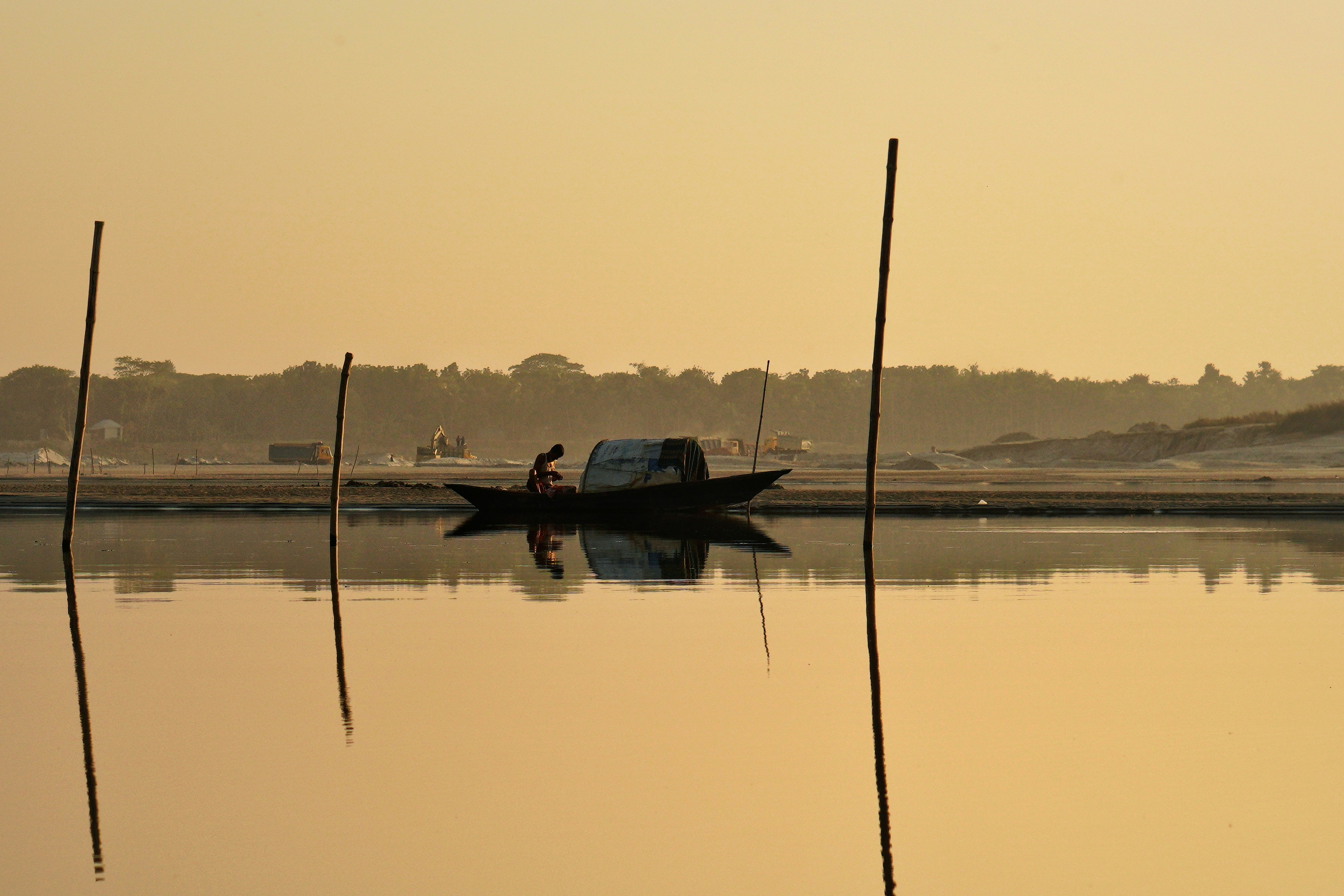 person riding on boat on body of water during daytime