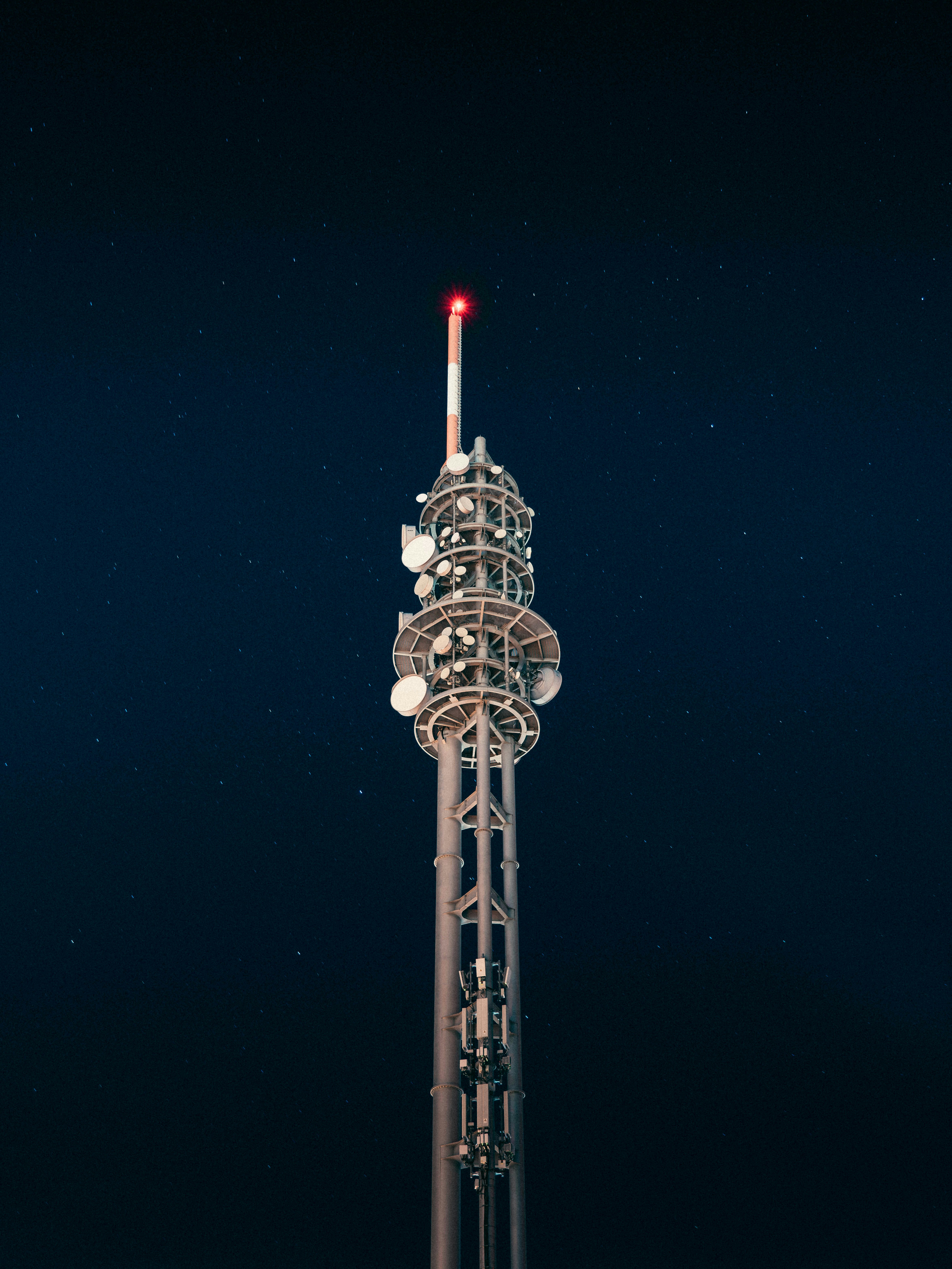 Starfed Lattice: Night Telecommunication Tower Against a Velvet Sky