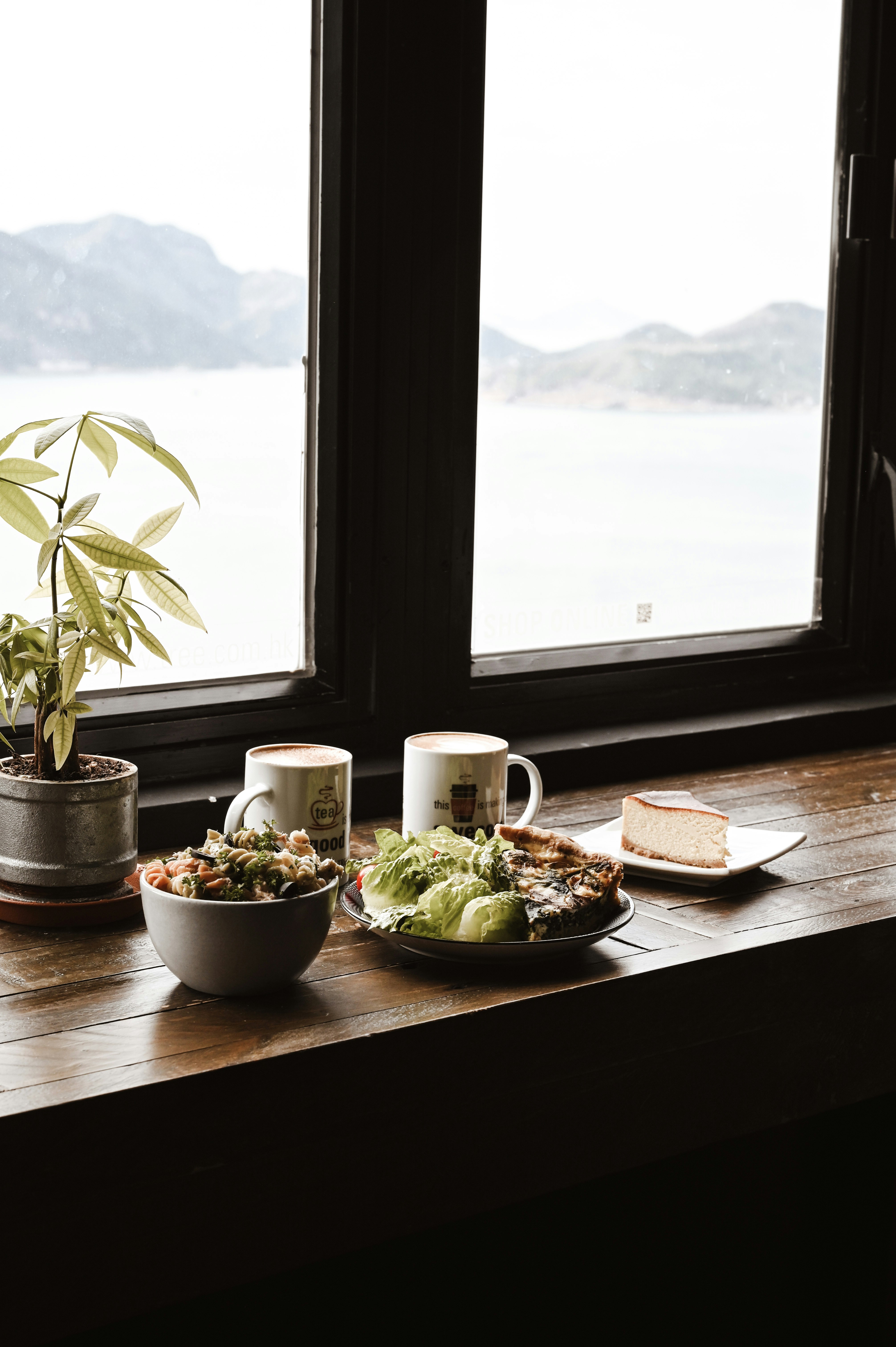 Windowsill Feast: A Quiet Meal with a Sea View
