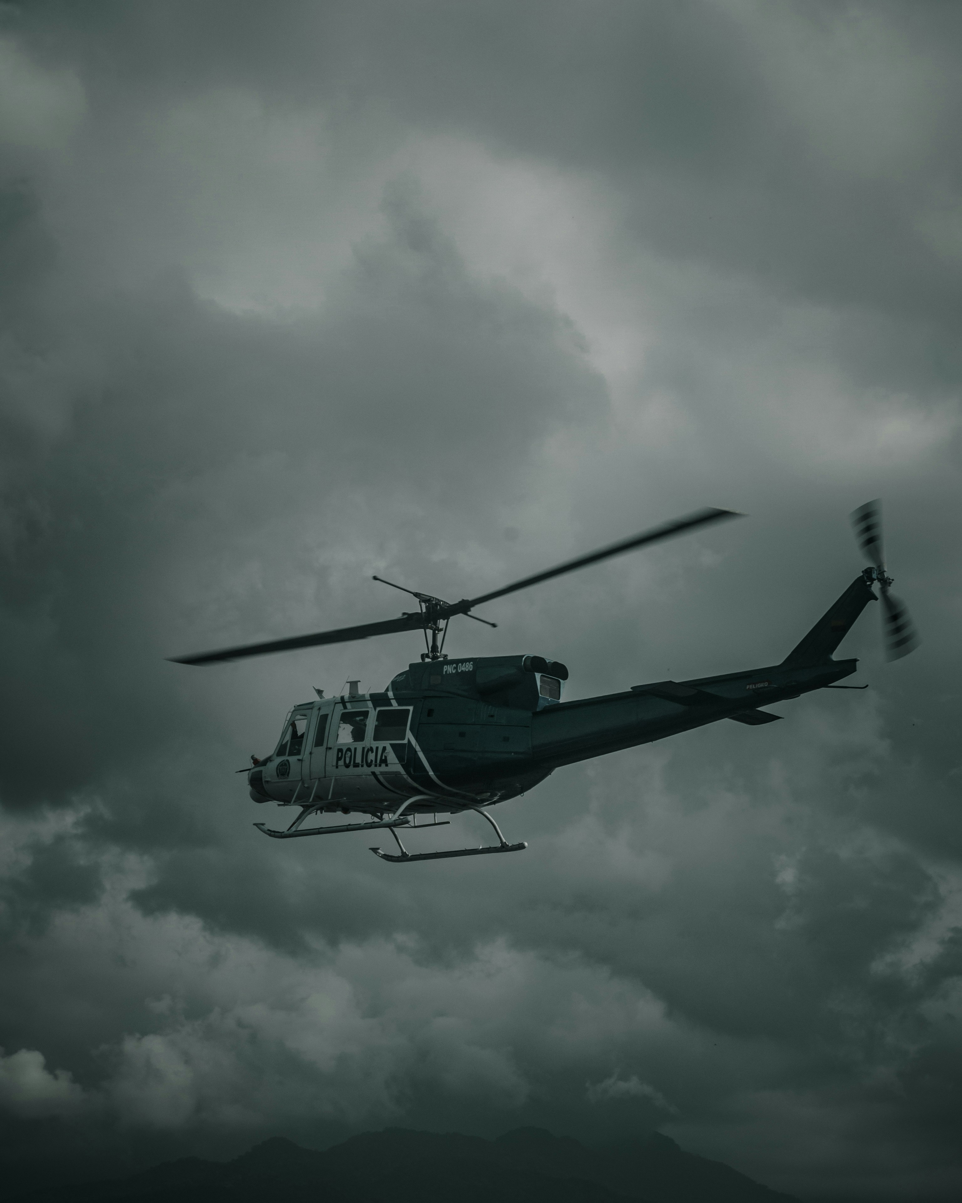 Stormbound Pursuit: A Police Helicopter Amid Thunderclouds