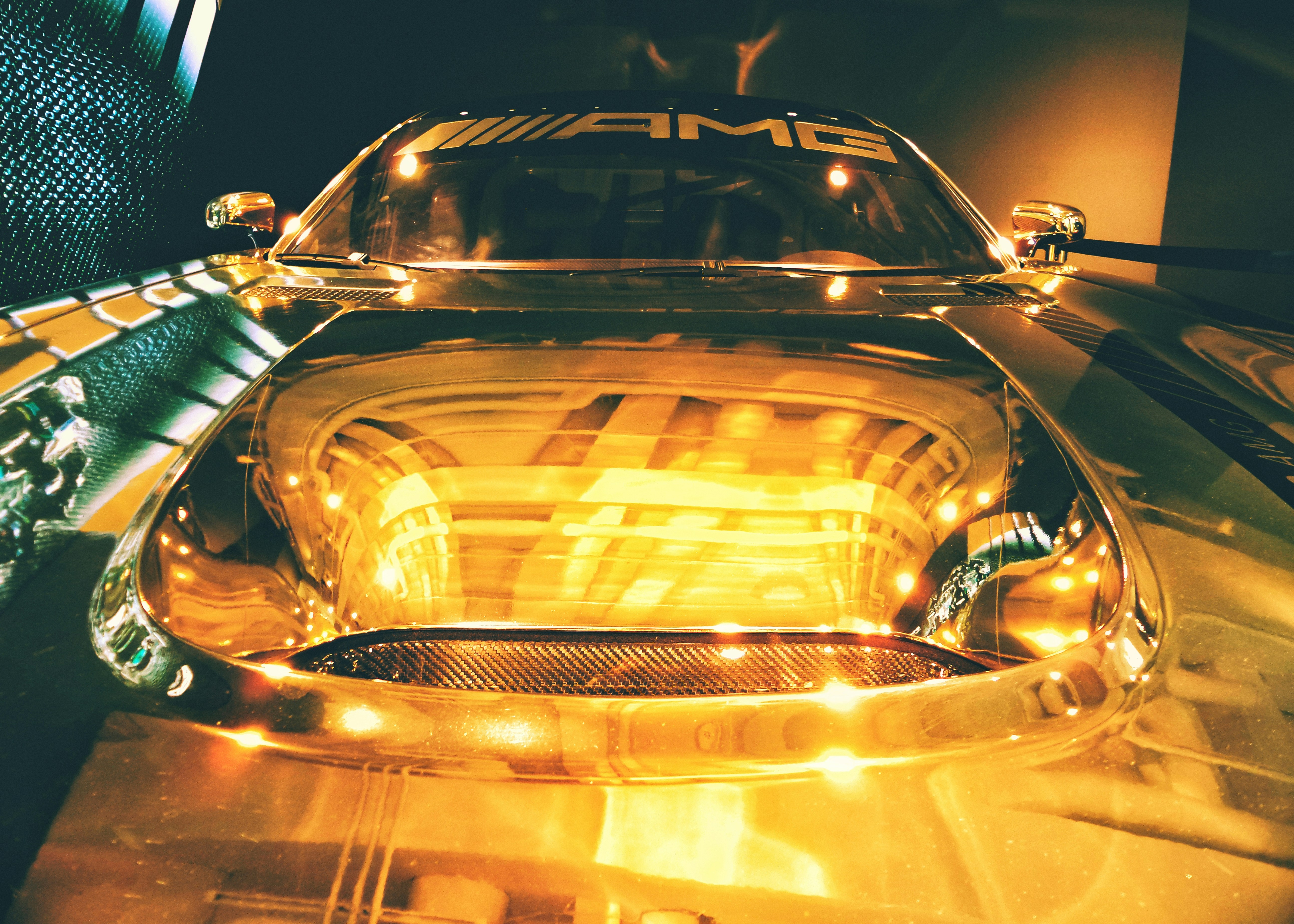 Gold Echo at the Fore: AMG's Front Glare in a Neon-Softened Tunnel