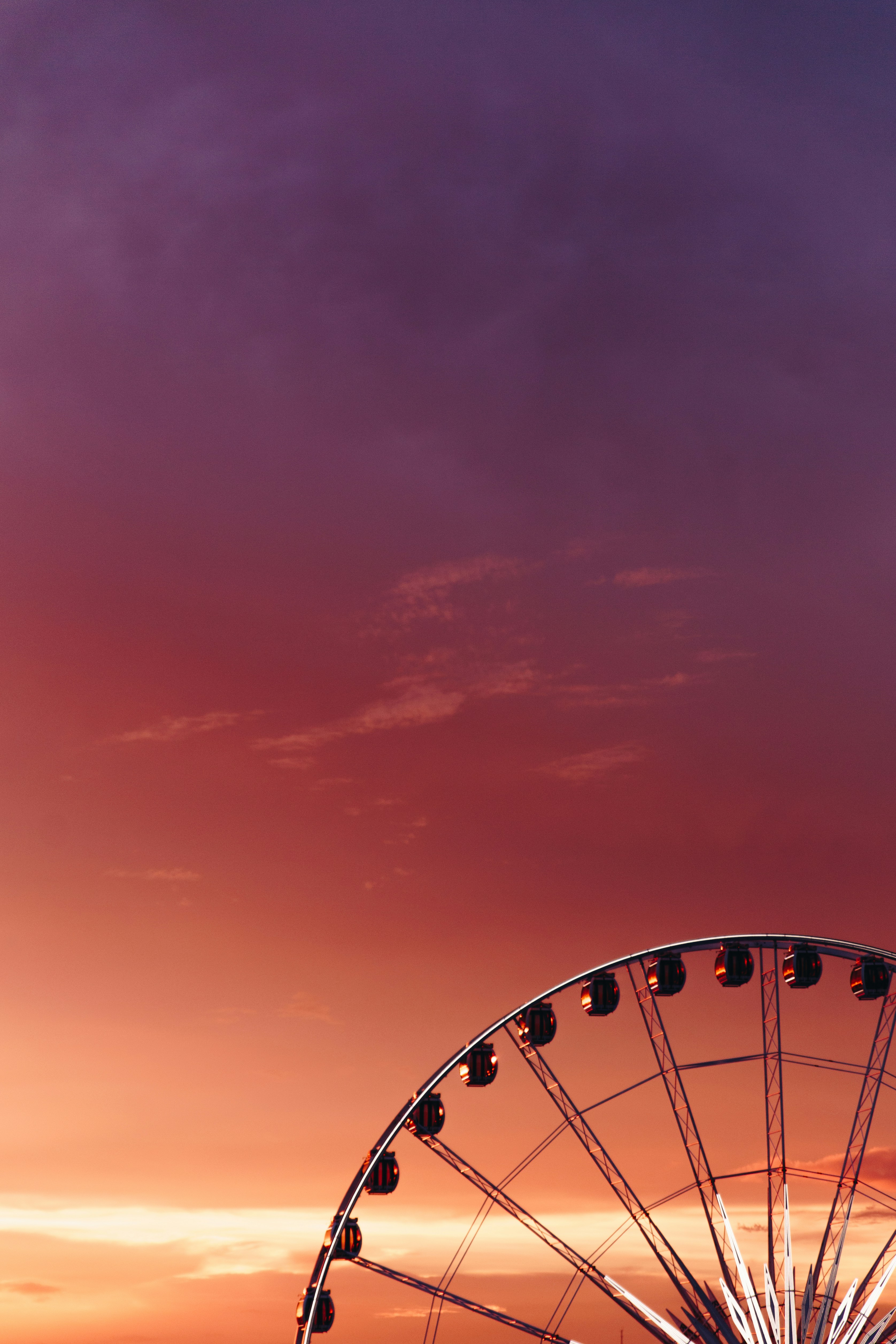 Sunset Ride: A Lantern Wheel Against a Lava Sky