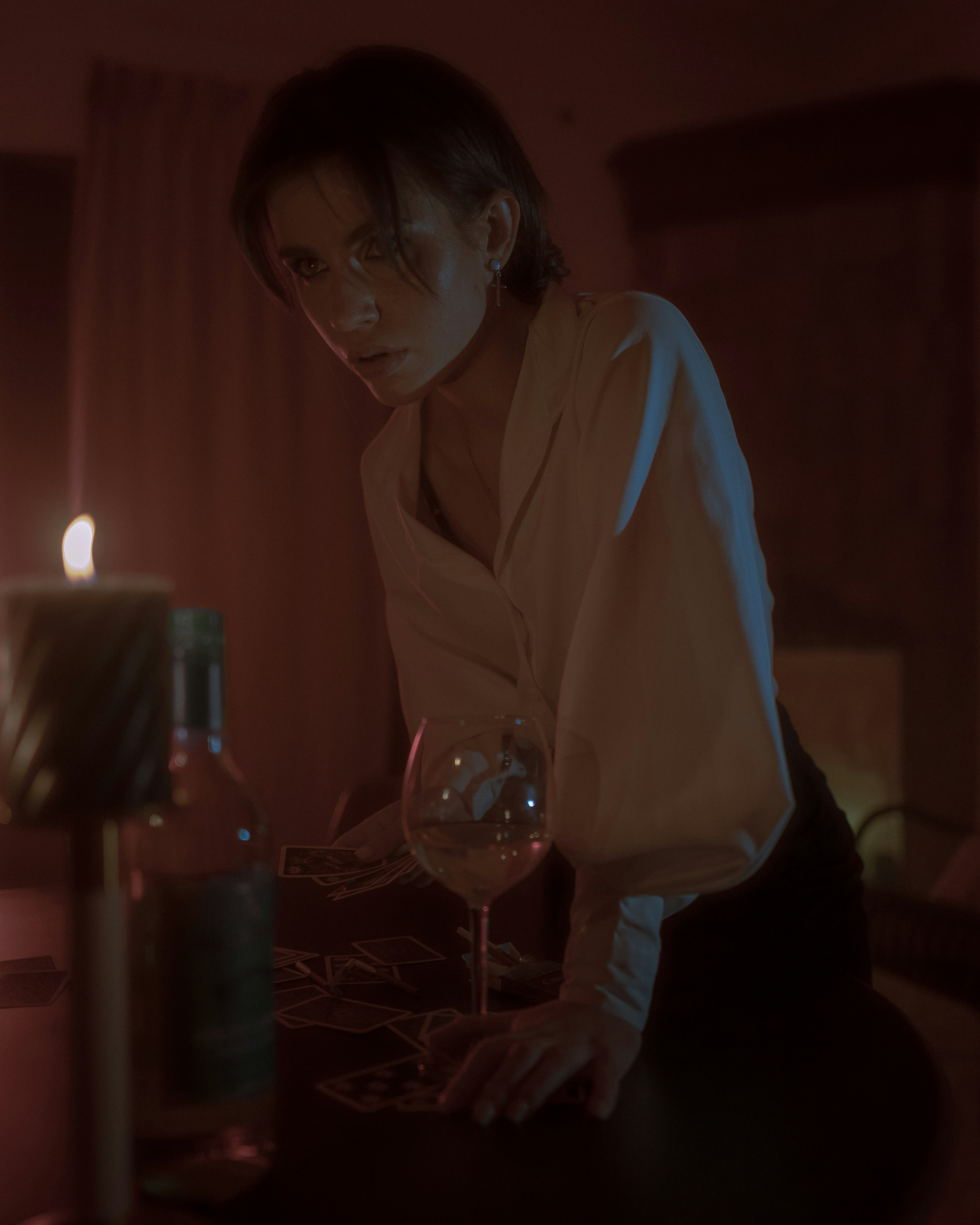 Candlelit Contemplation Over a Card Table