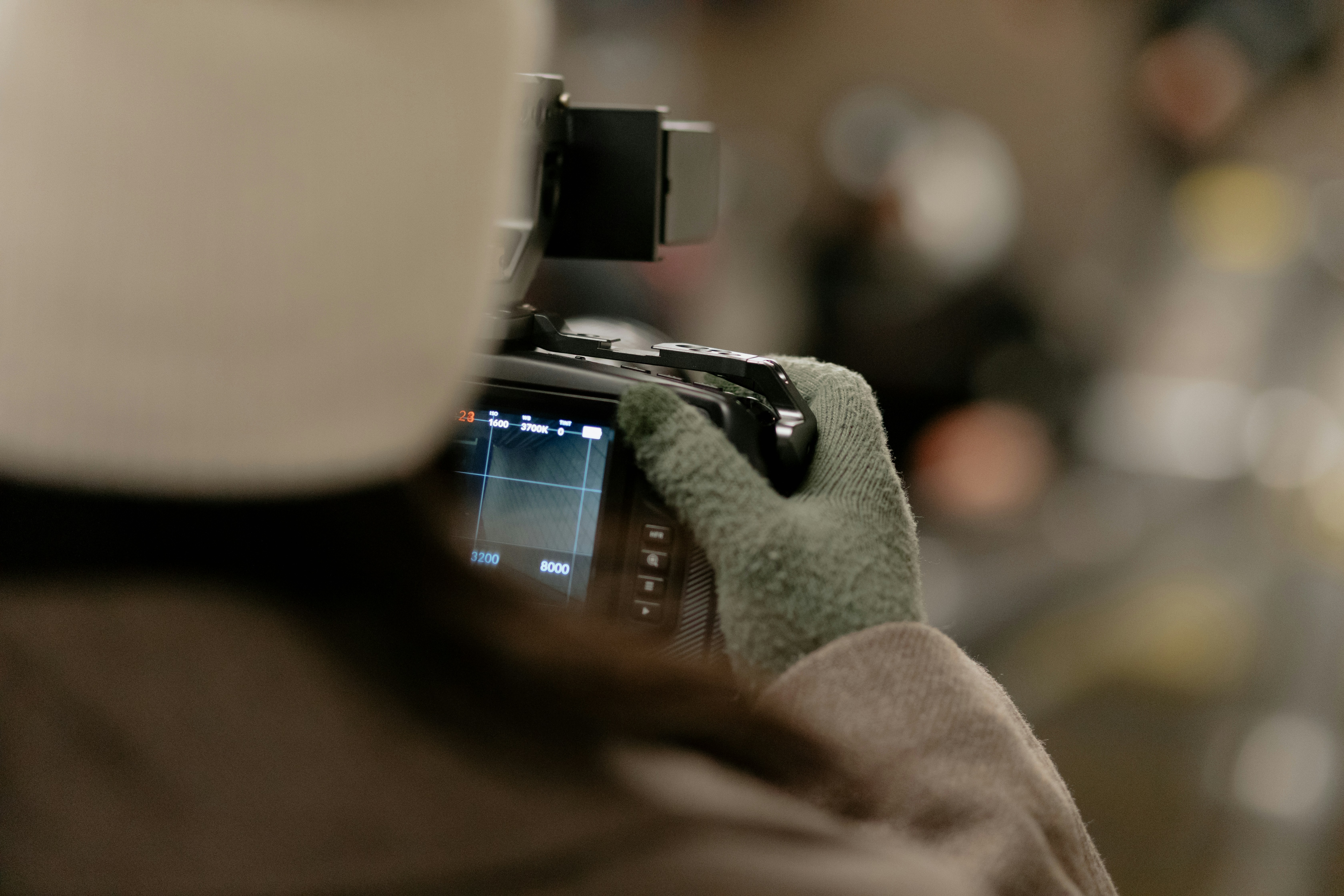 Gloved Hands at the Back Screen: Quiet Focus Behind the Camera
