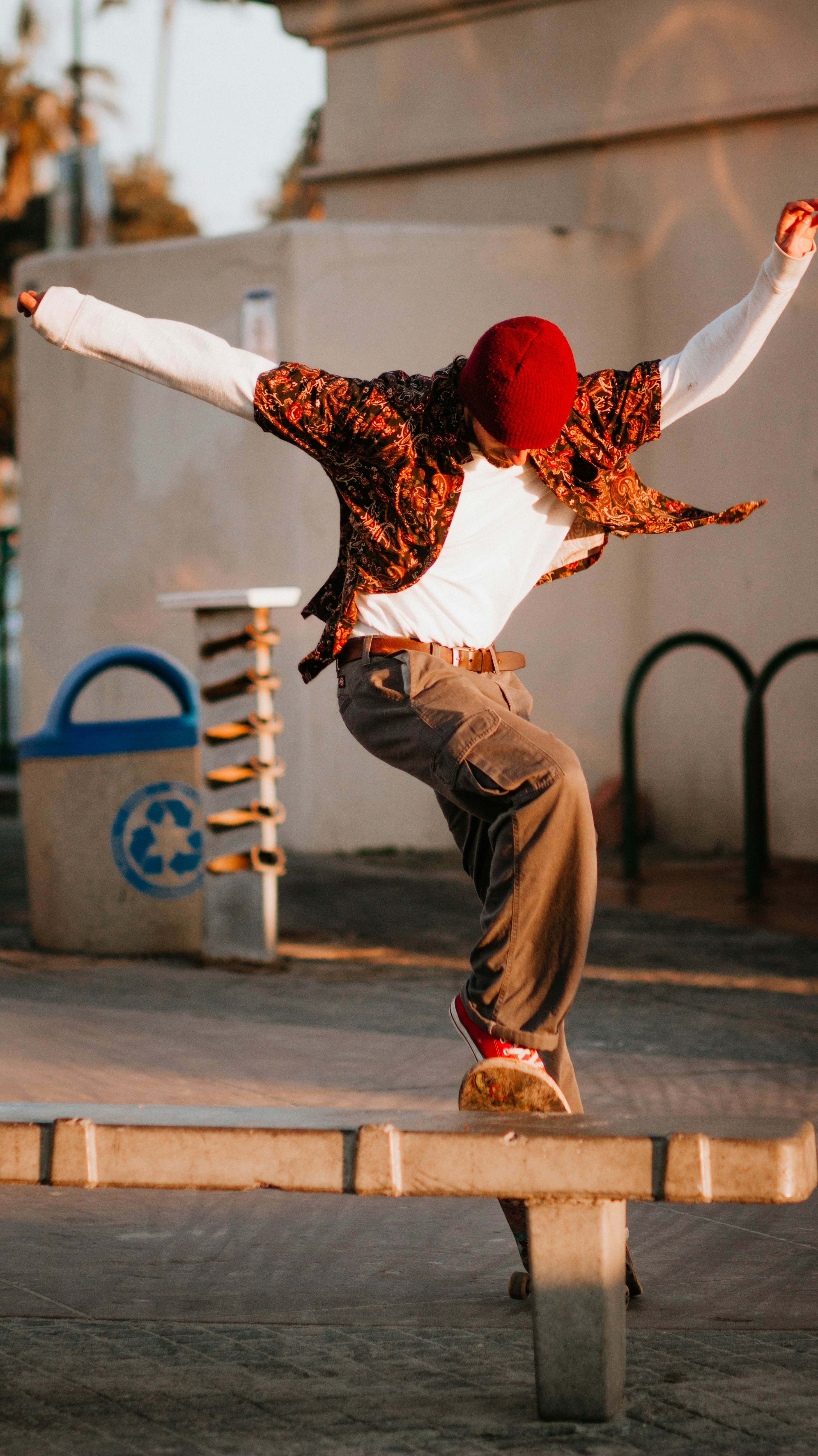 Man in white shirt and brown pants jumping on brown wooden floor during ...
