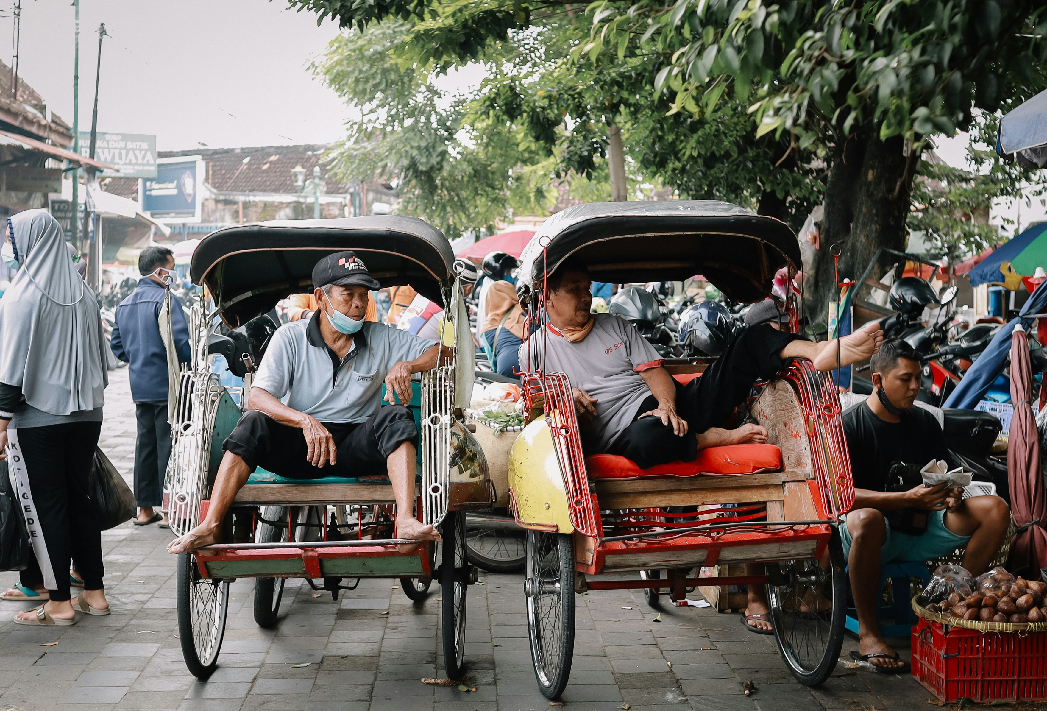 People riding on red and black auto rickshaw during daytime photo ...