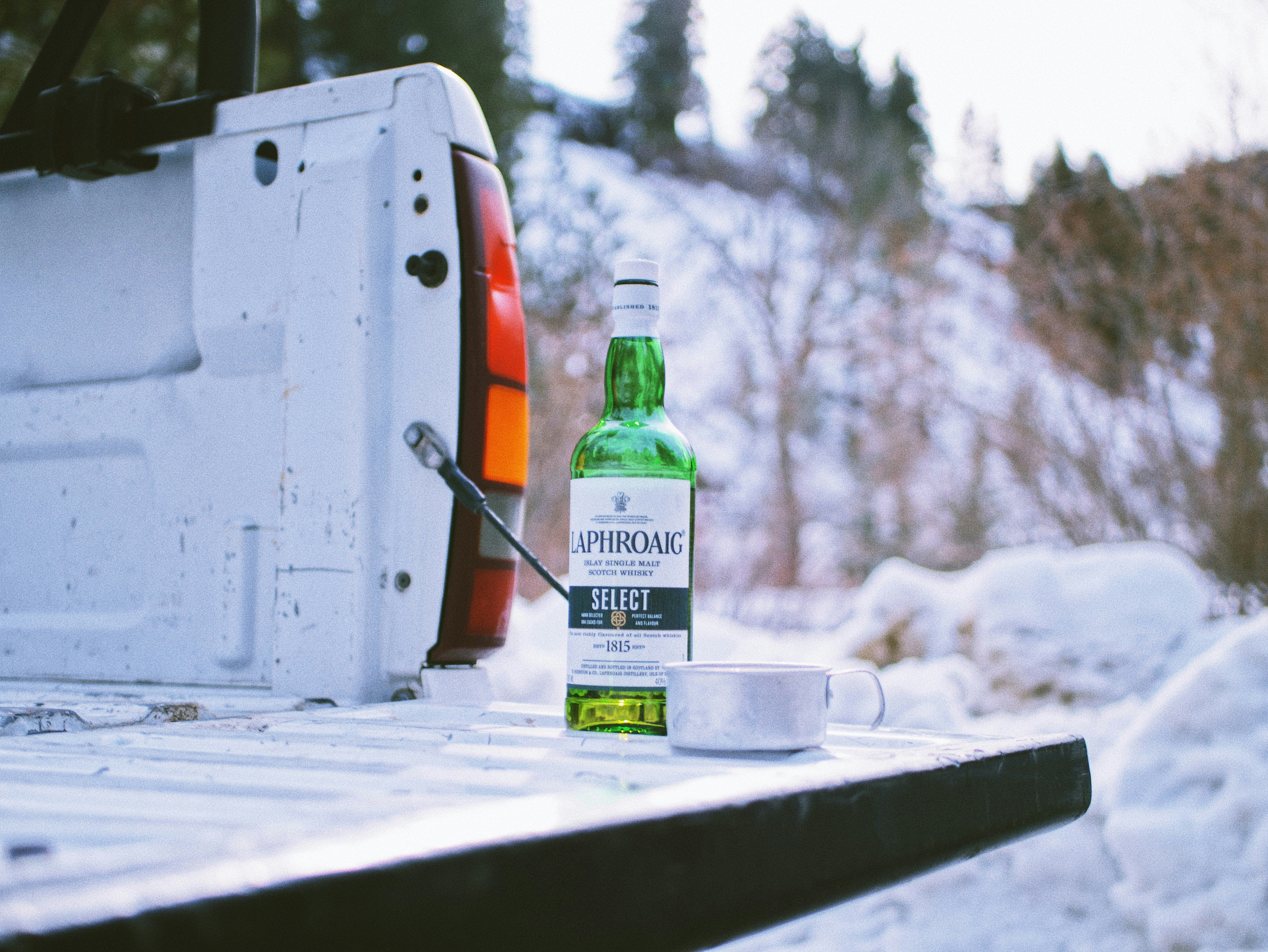 Arctic Pause: Aphroaig Select on a Snow-Covered Tailgate