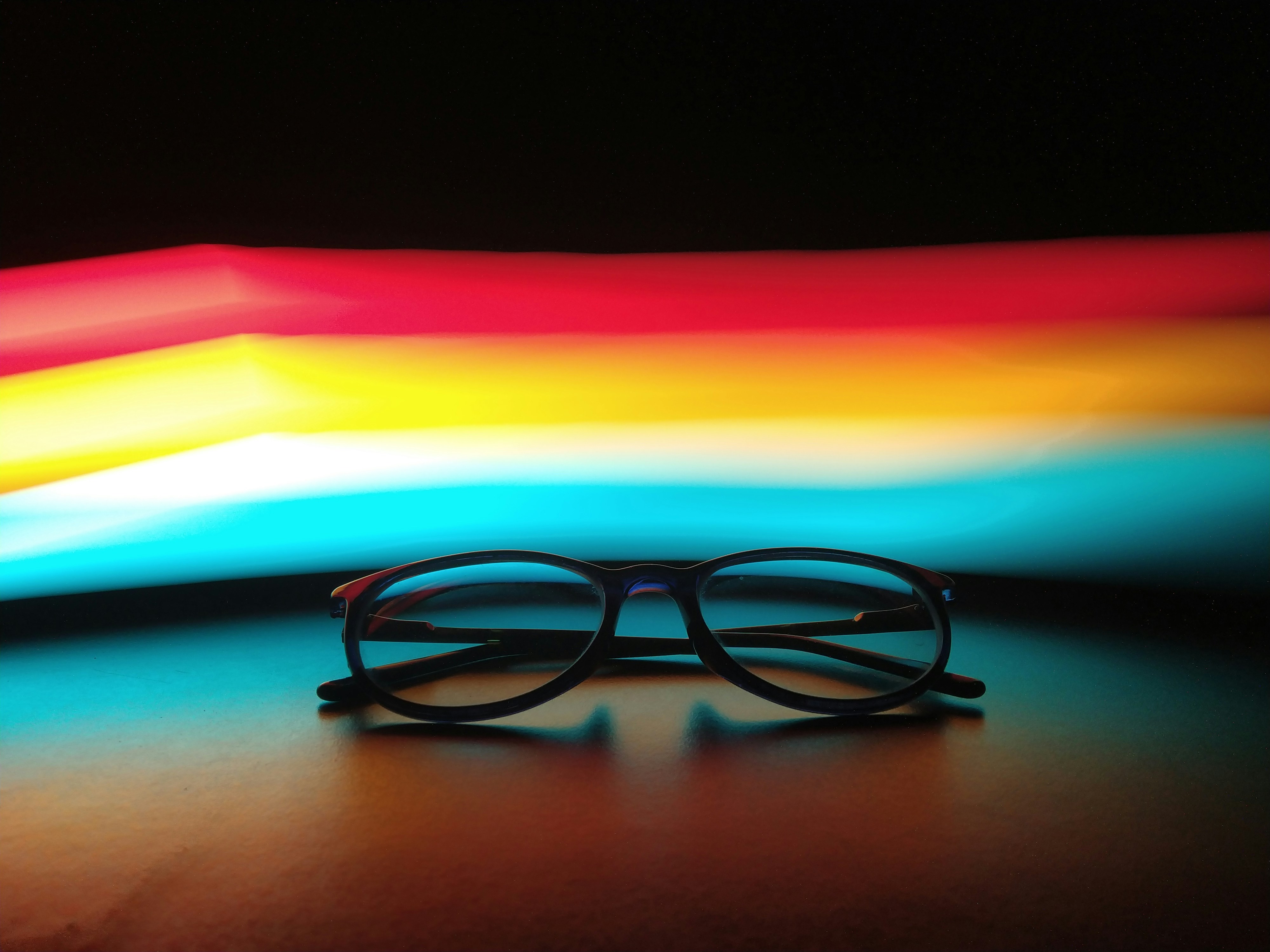Neon Streaks Over Spectacles