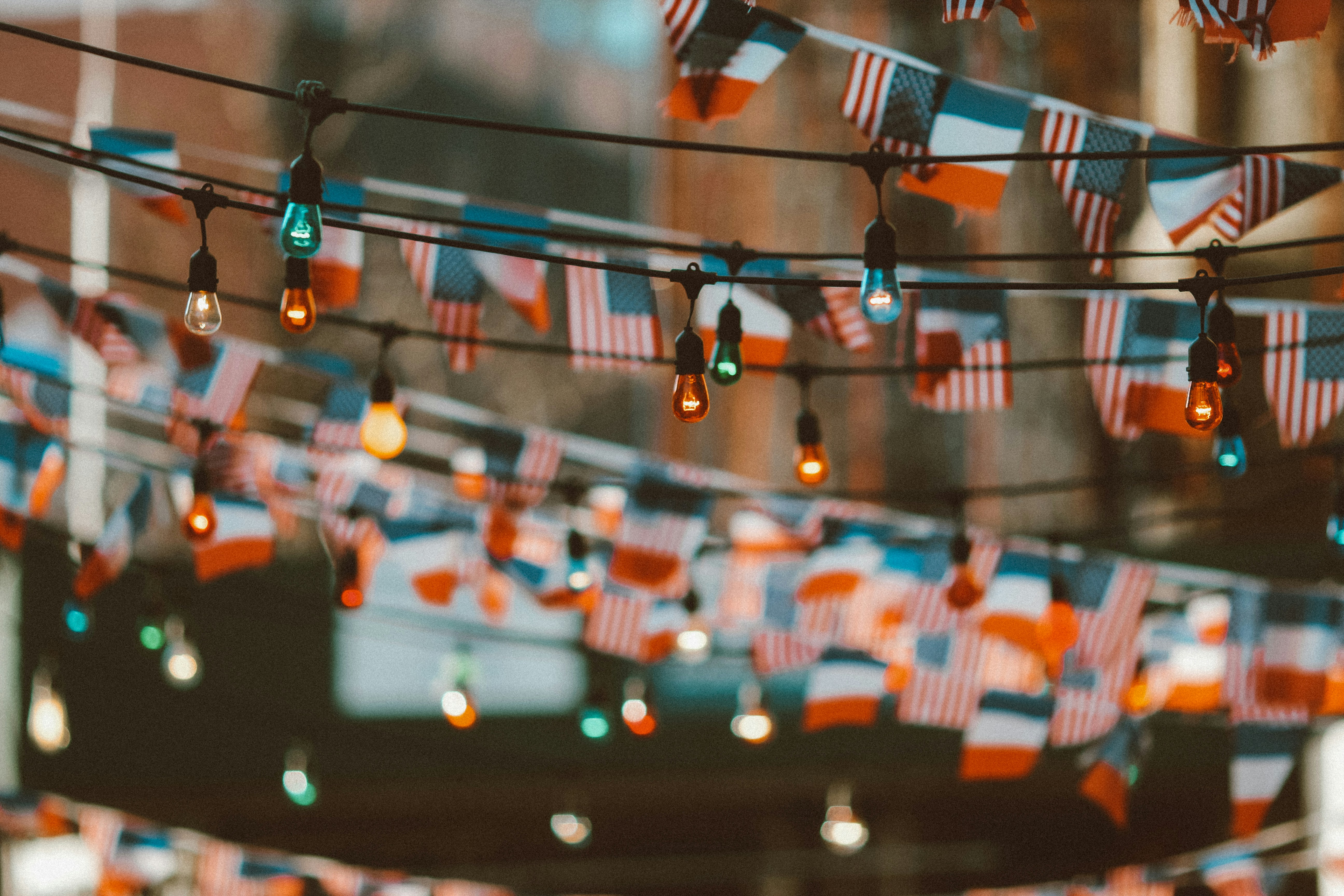 Festival Lights: Bunting and Neon Glimmers in an Evening Market