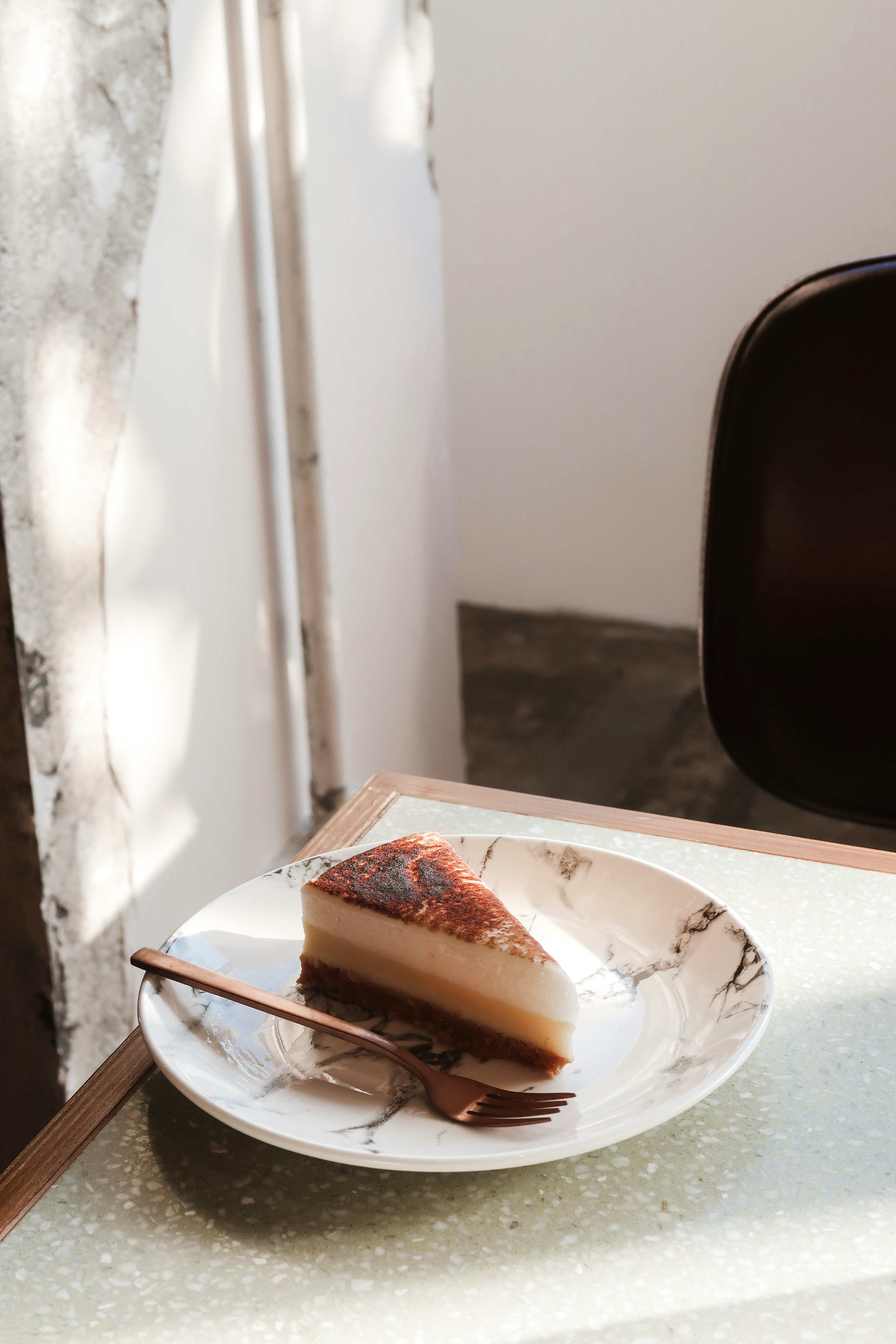 Slice of Quiet Afternoon: Cheesecake on Marble and Light