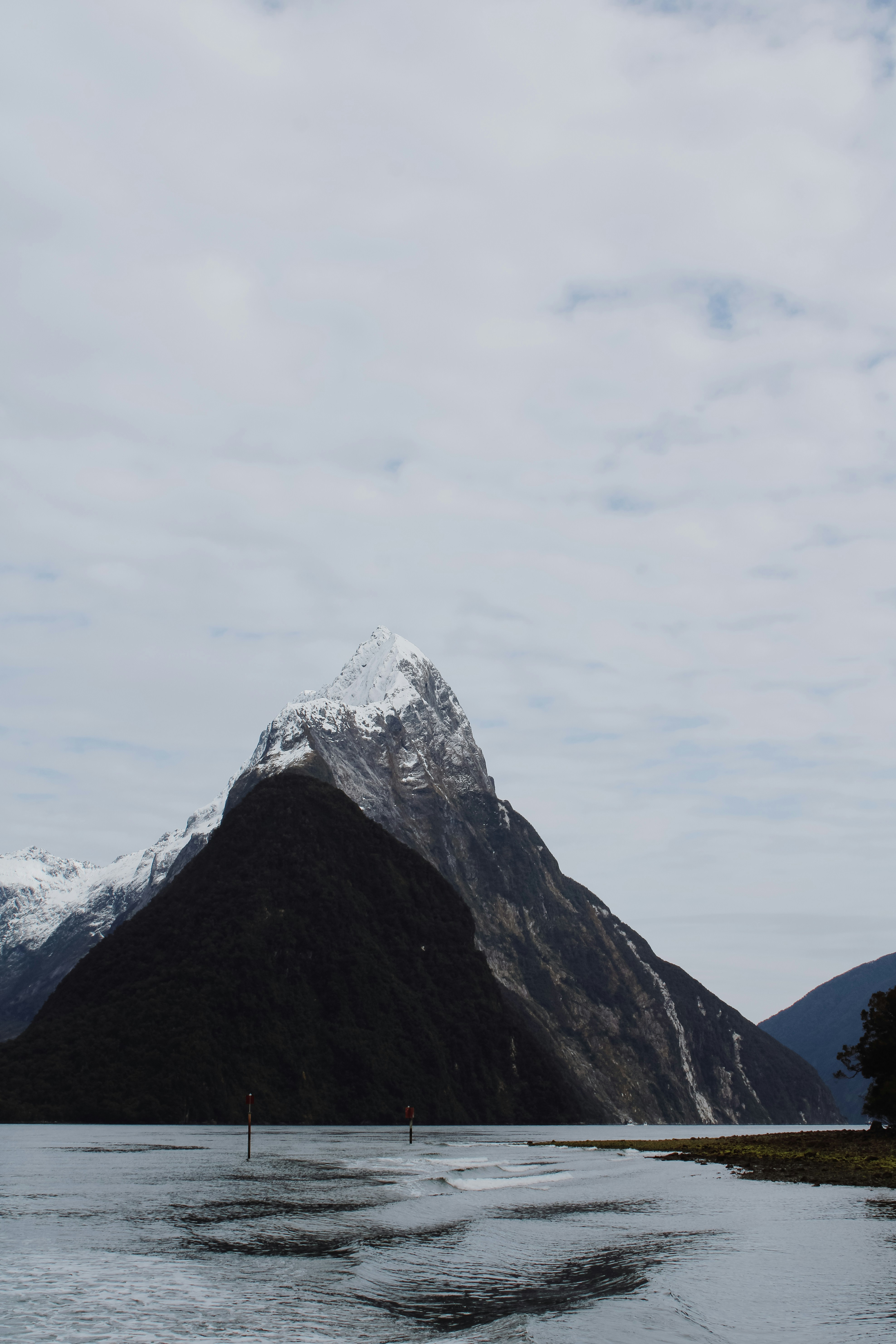 Snow-Capped Peak Reaching Toward a Misty Sky