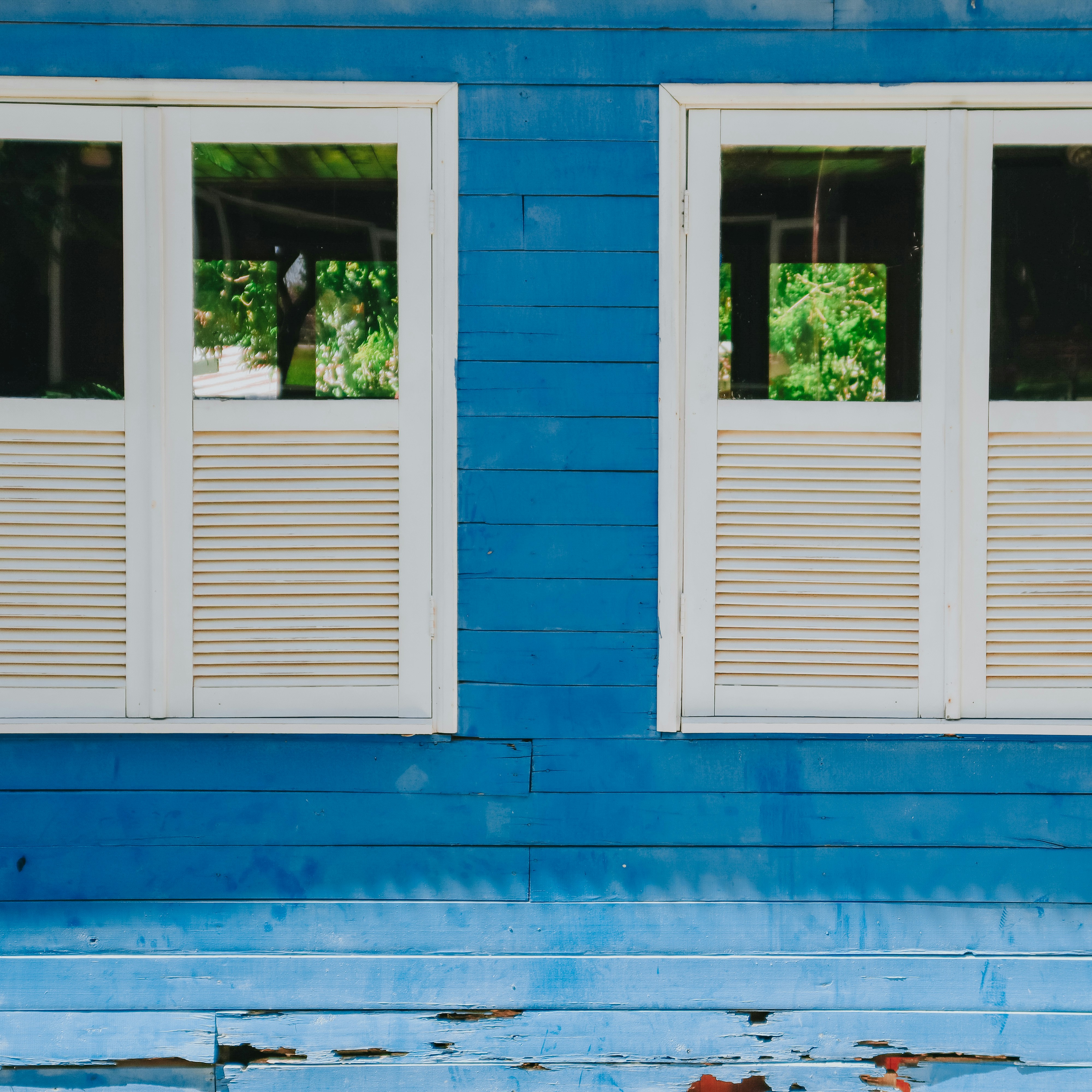 Blue wooden window frame on blue concrete wall photo – Free Blue Image ...