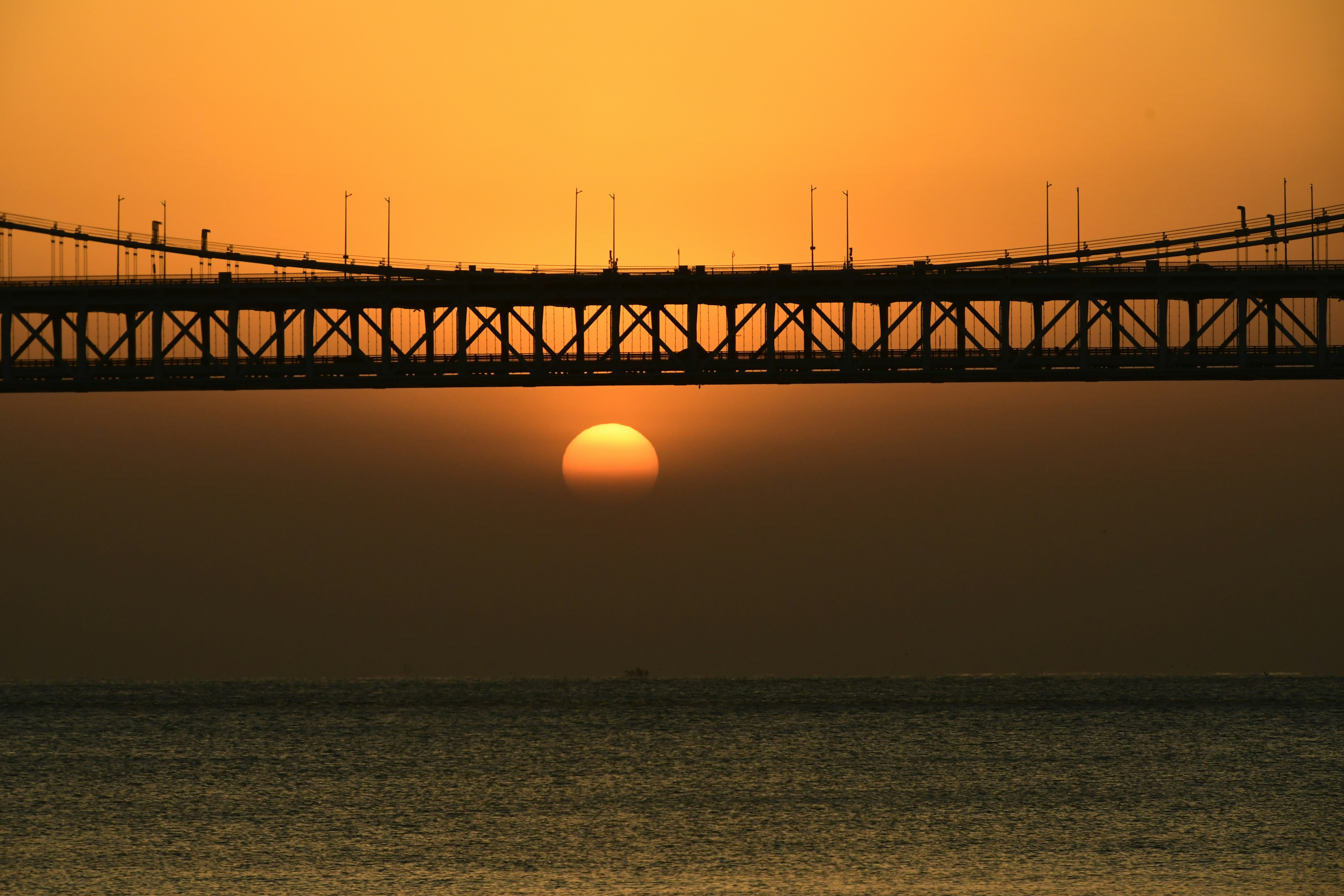 Golden hour over bridge over the sea photo – Free Sun Image on Unsplash