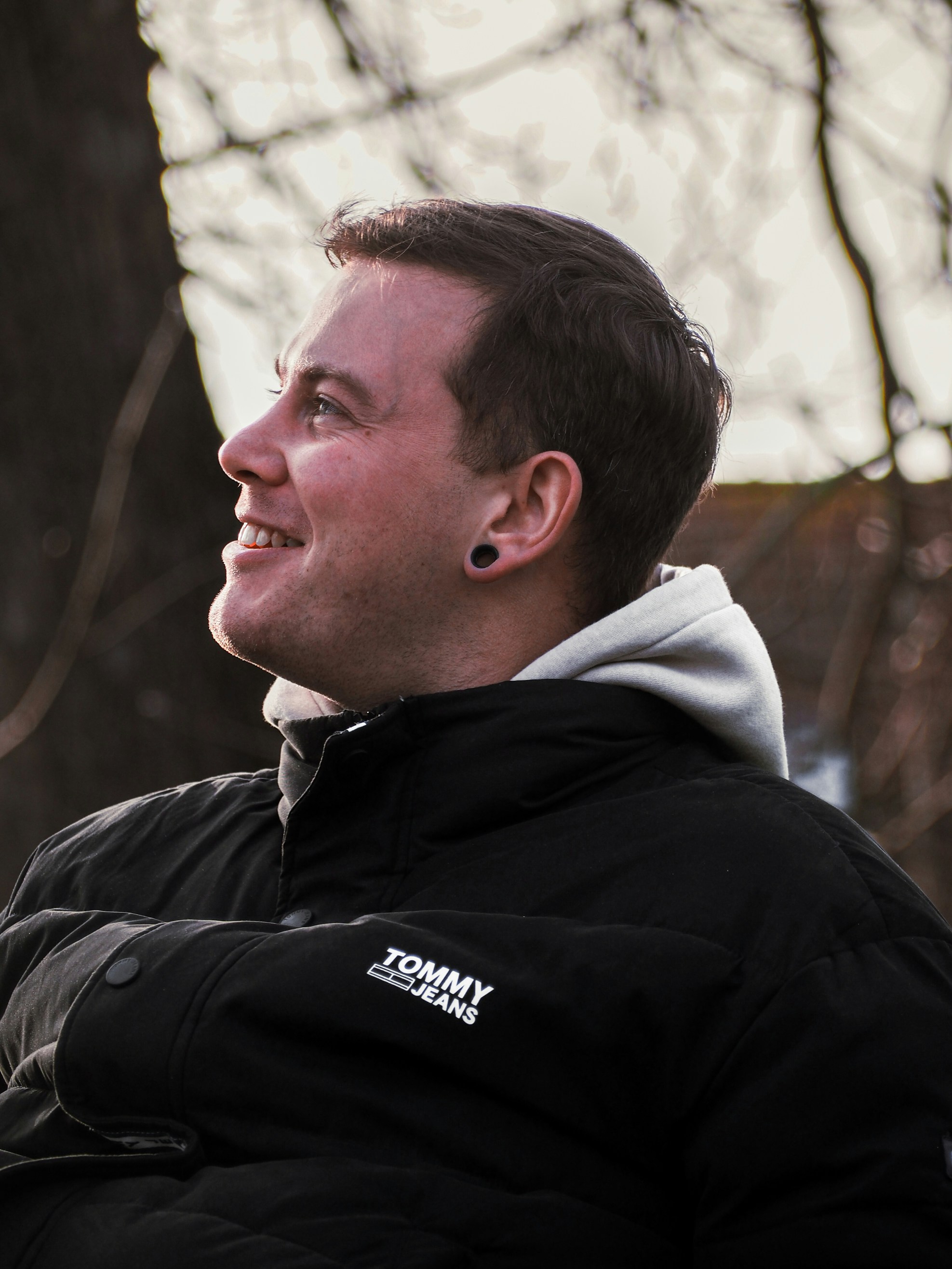 Winter Light Portrait: A Side Profile with a Warm Smile