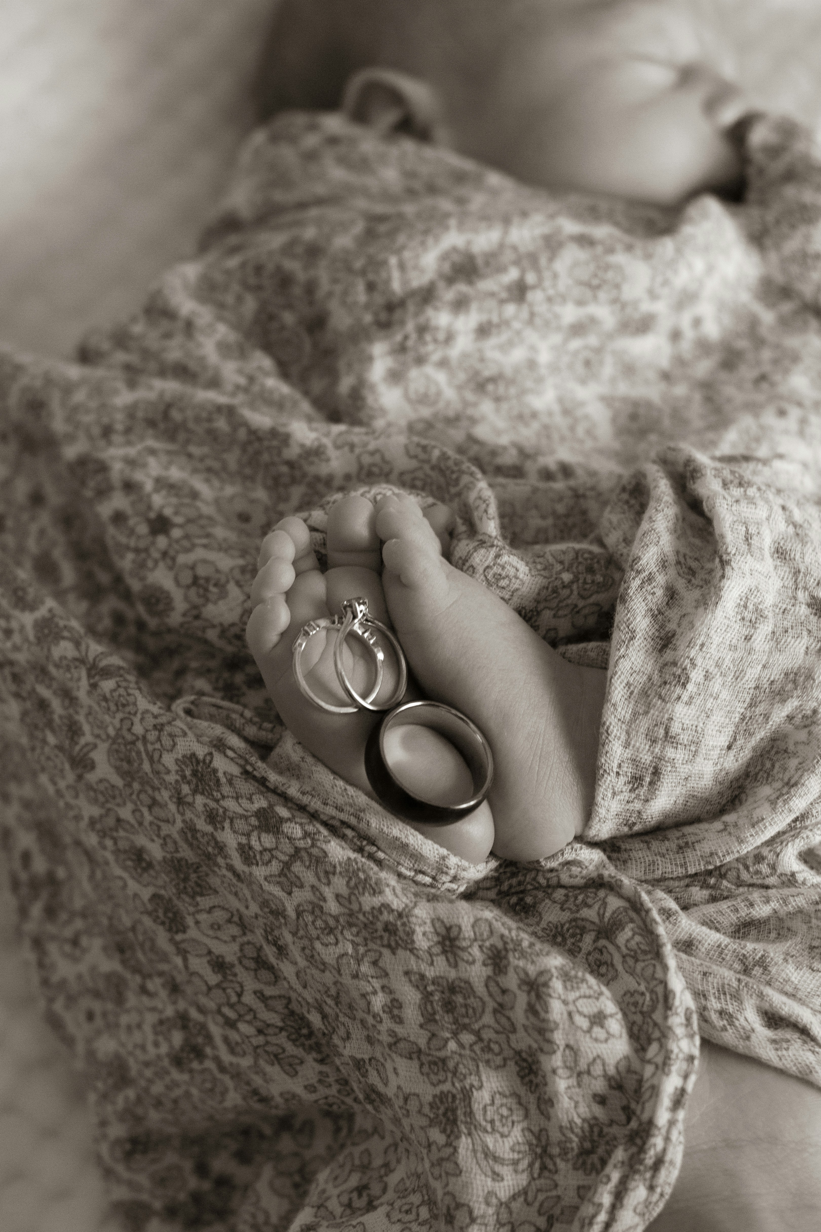 Tiny Steps: A Quiet Moment with Baby's Feet and Rings