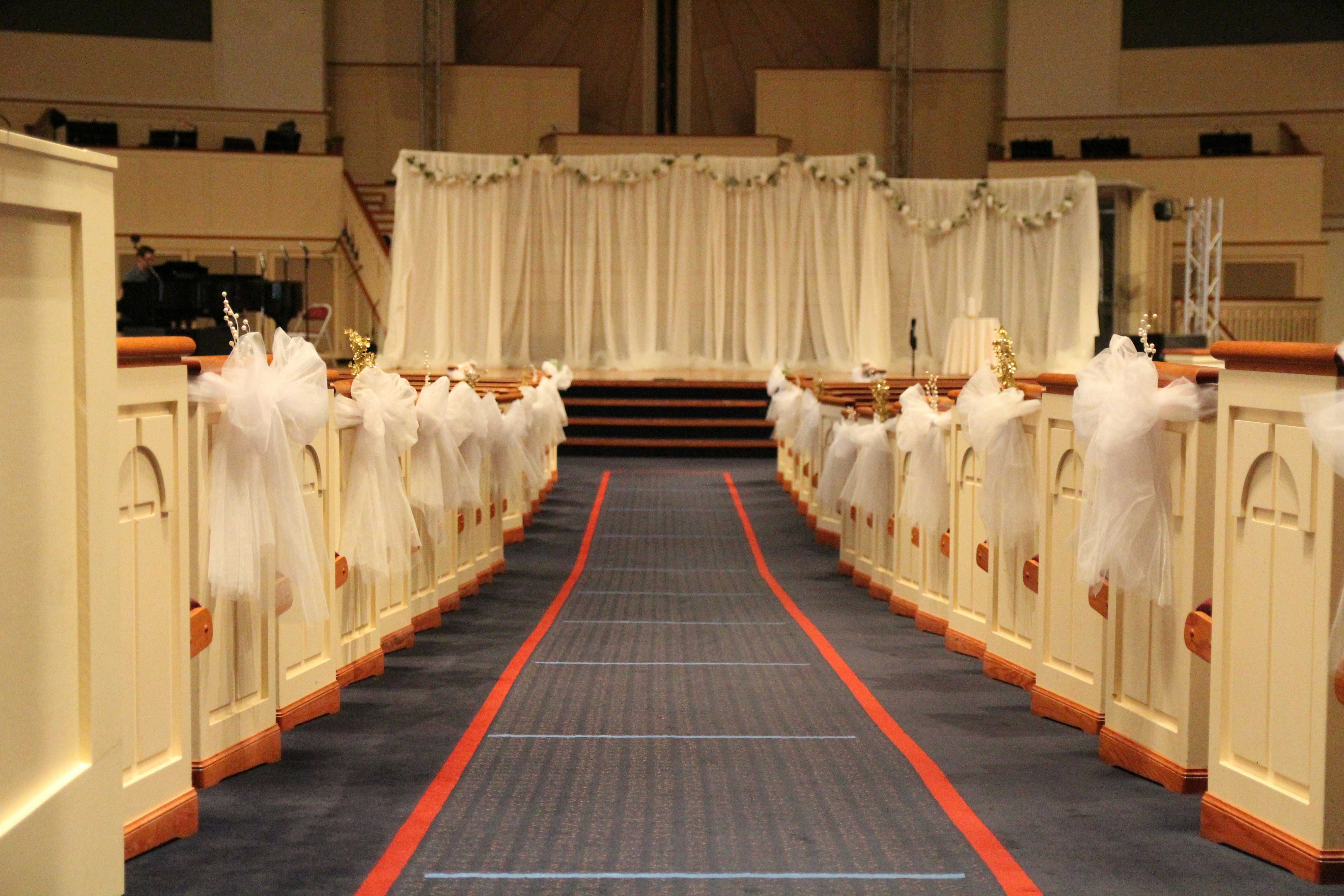 Aisle to the Altar: Graceful Path Through the Draped Church Hall
