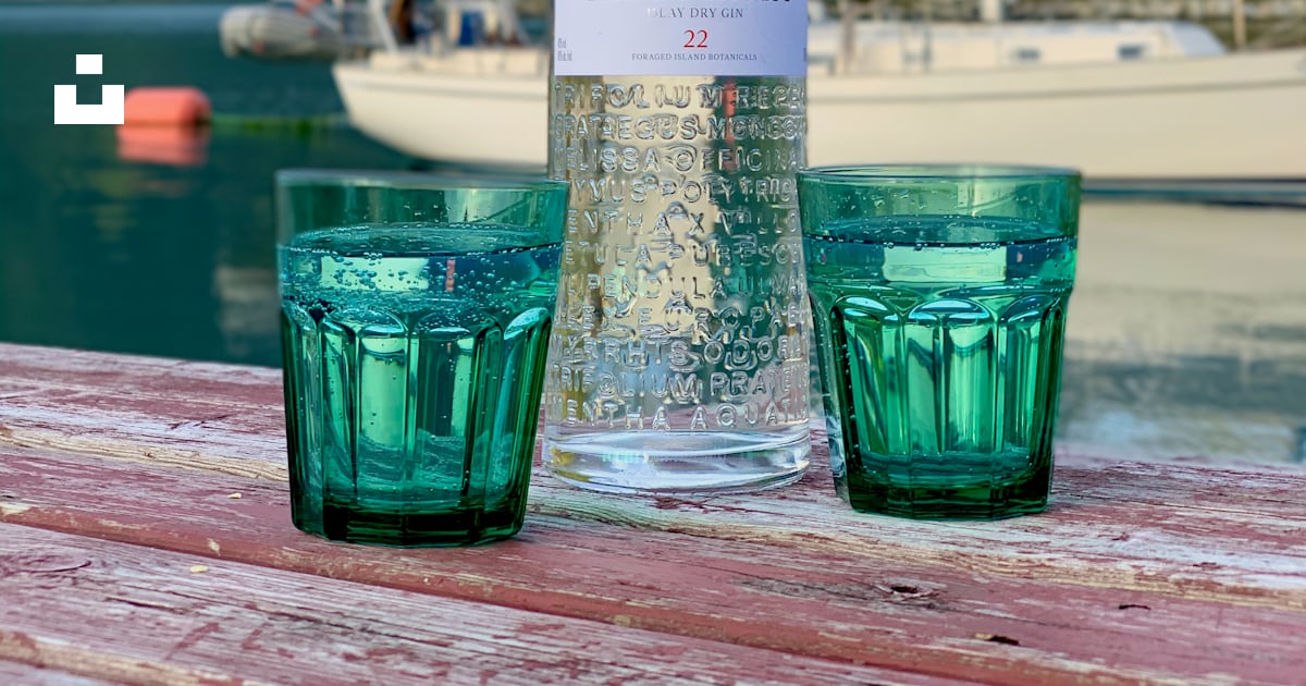 Clear Glass Bottle Beside Green Drinking Glass Photo Free Bondhus