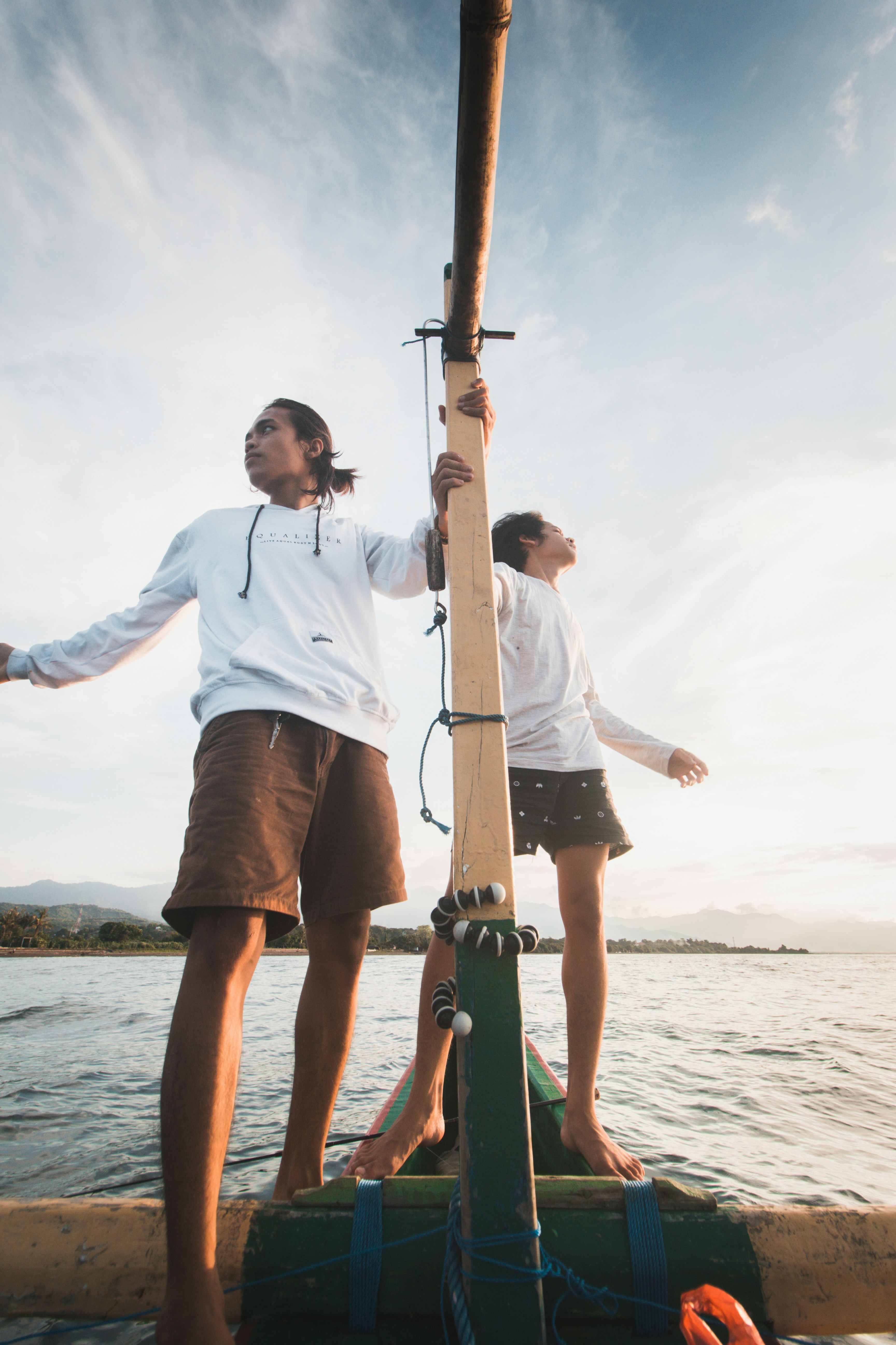 Dawn on the Outrigger: Two Adventurers Hold Ground at the Mast
