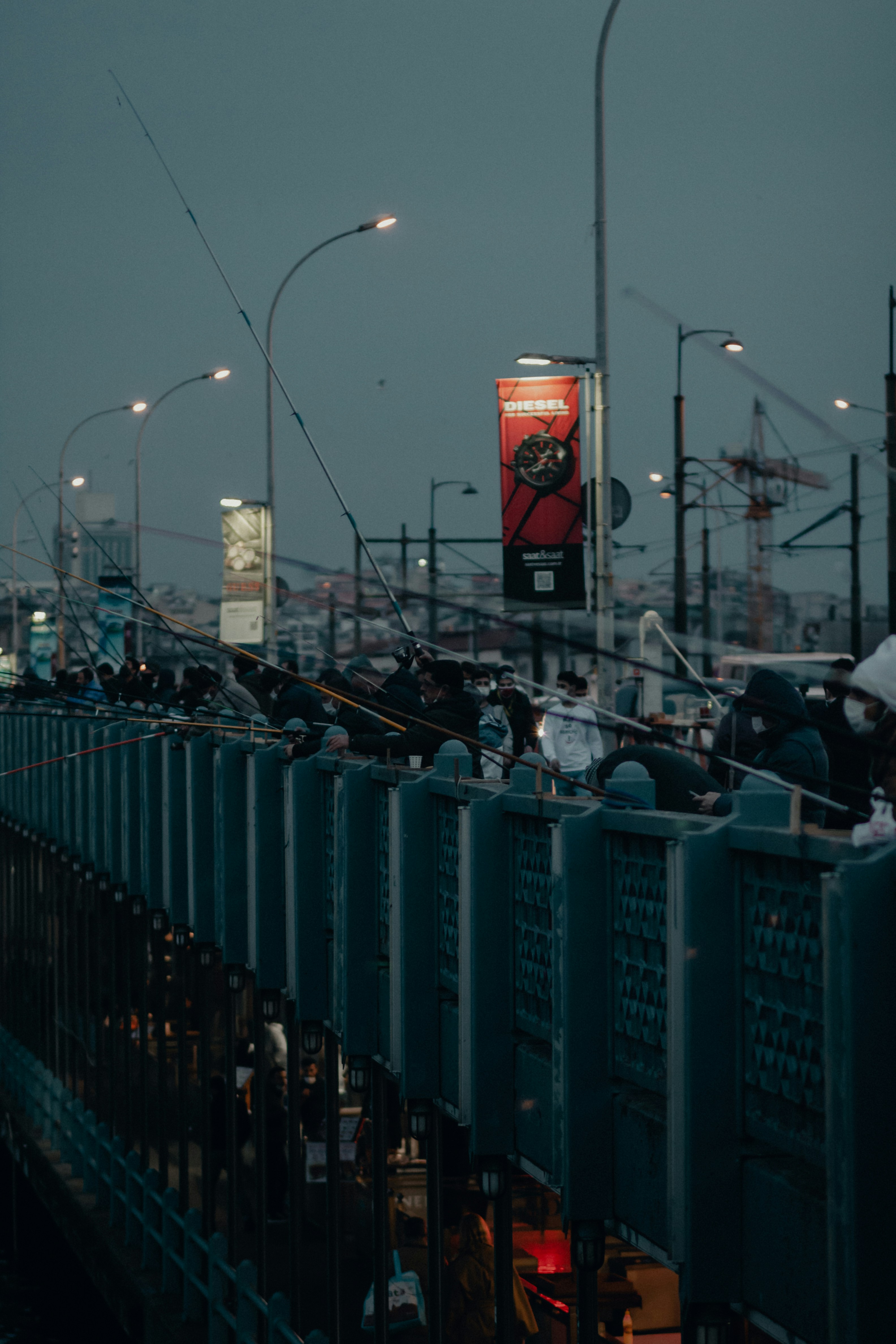 Urban Buckle: Night Fishermen on a Neon-Outlined Bridge