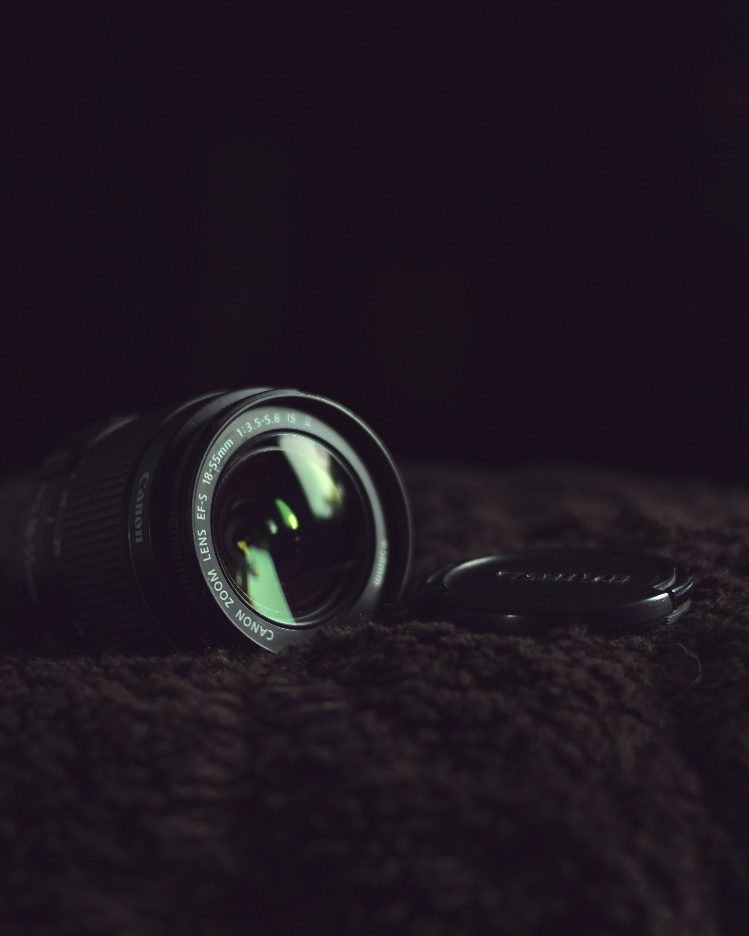 black camera lens on black textile