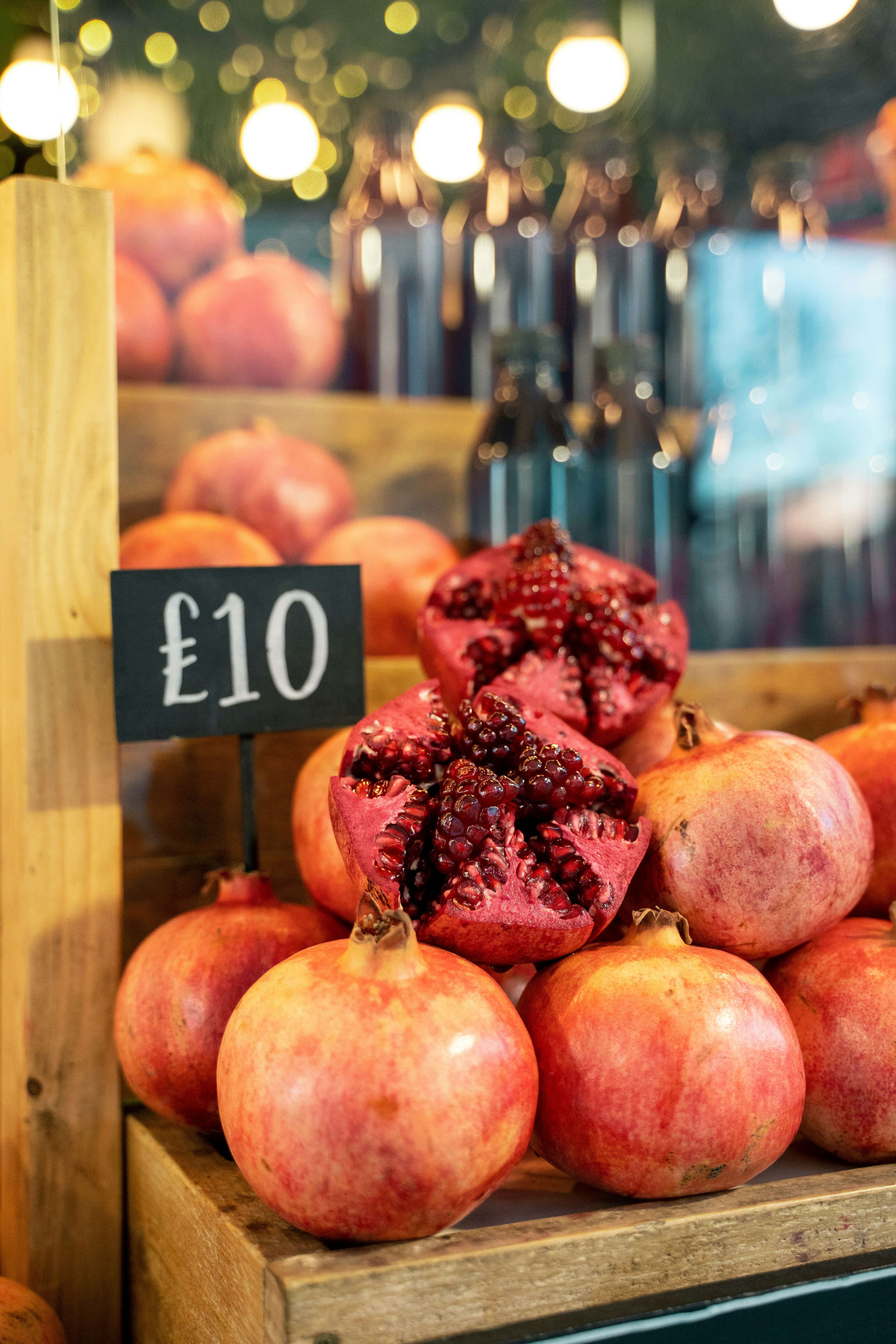 Crimson Core on Display: Opened Pomegranate Among Market Produce