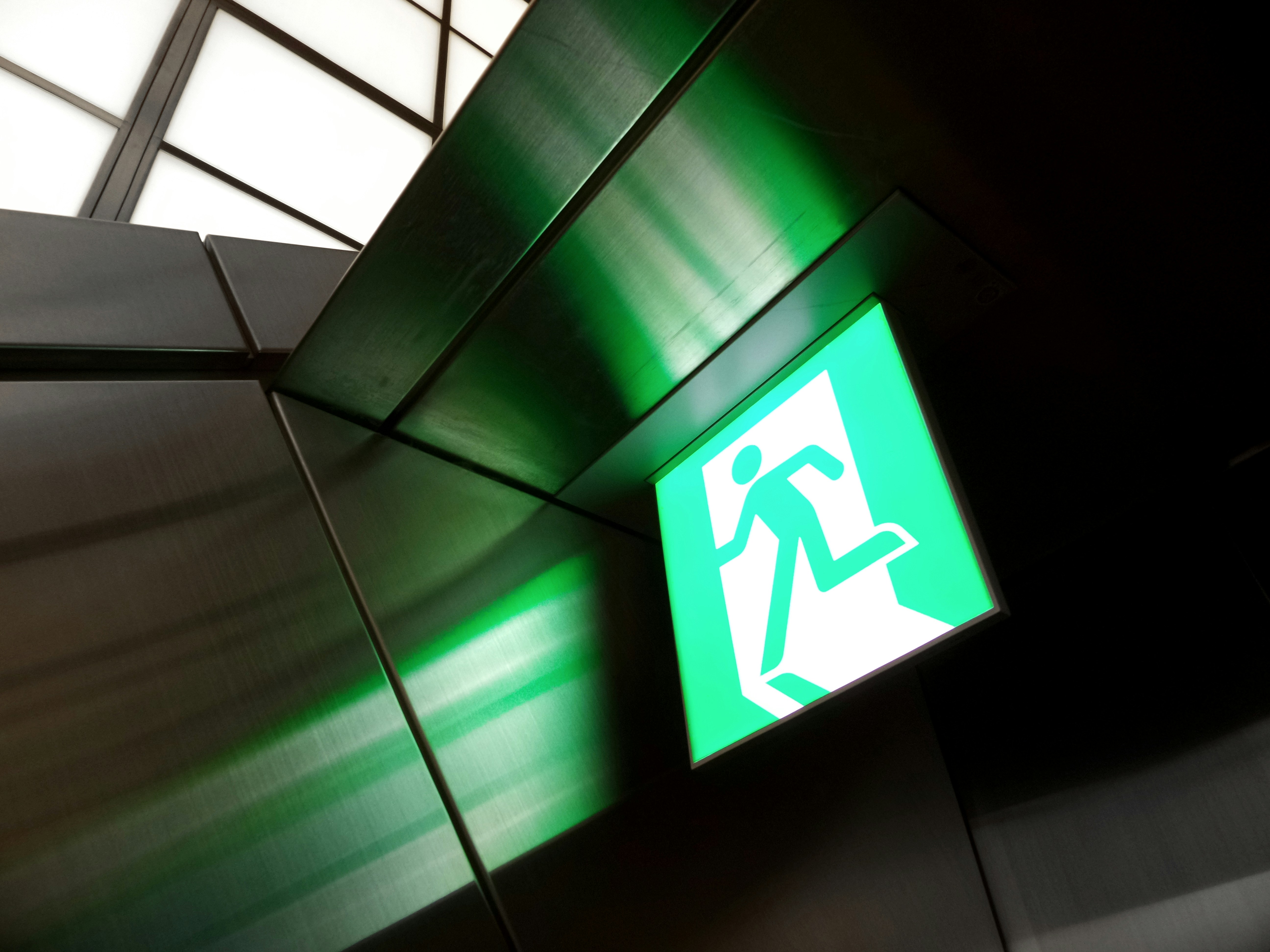 Green and white exit sign photo – Free Building Image on Unsplash
