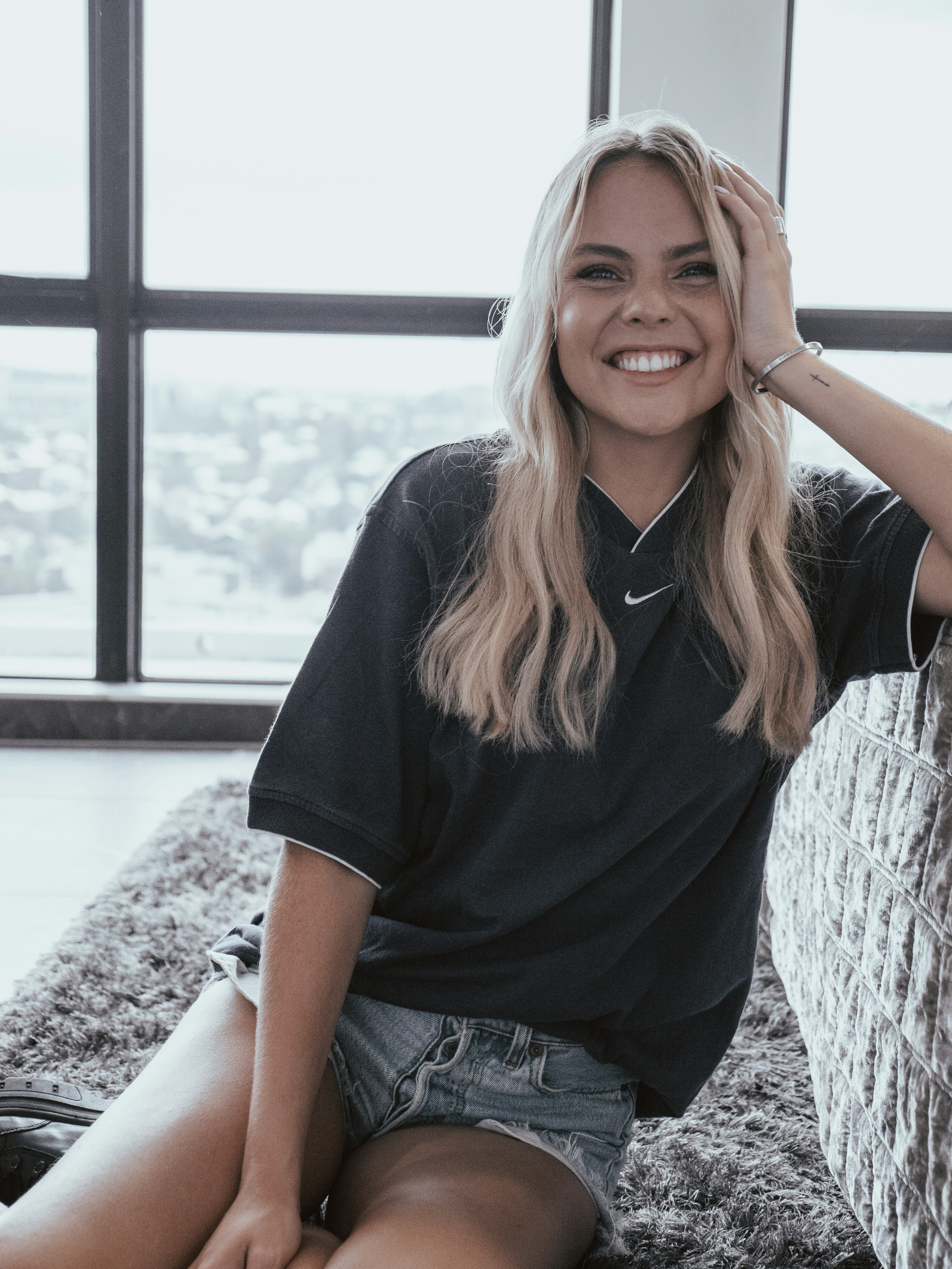 Casual Confidence: A Bright Smile in a Modern Loft
