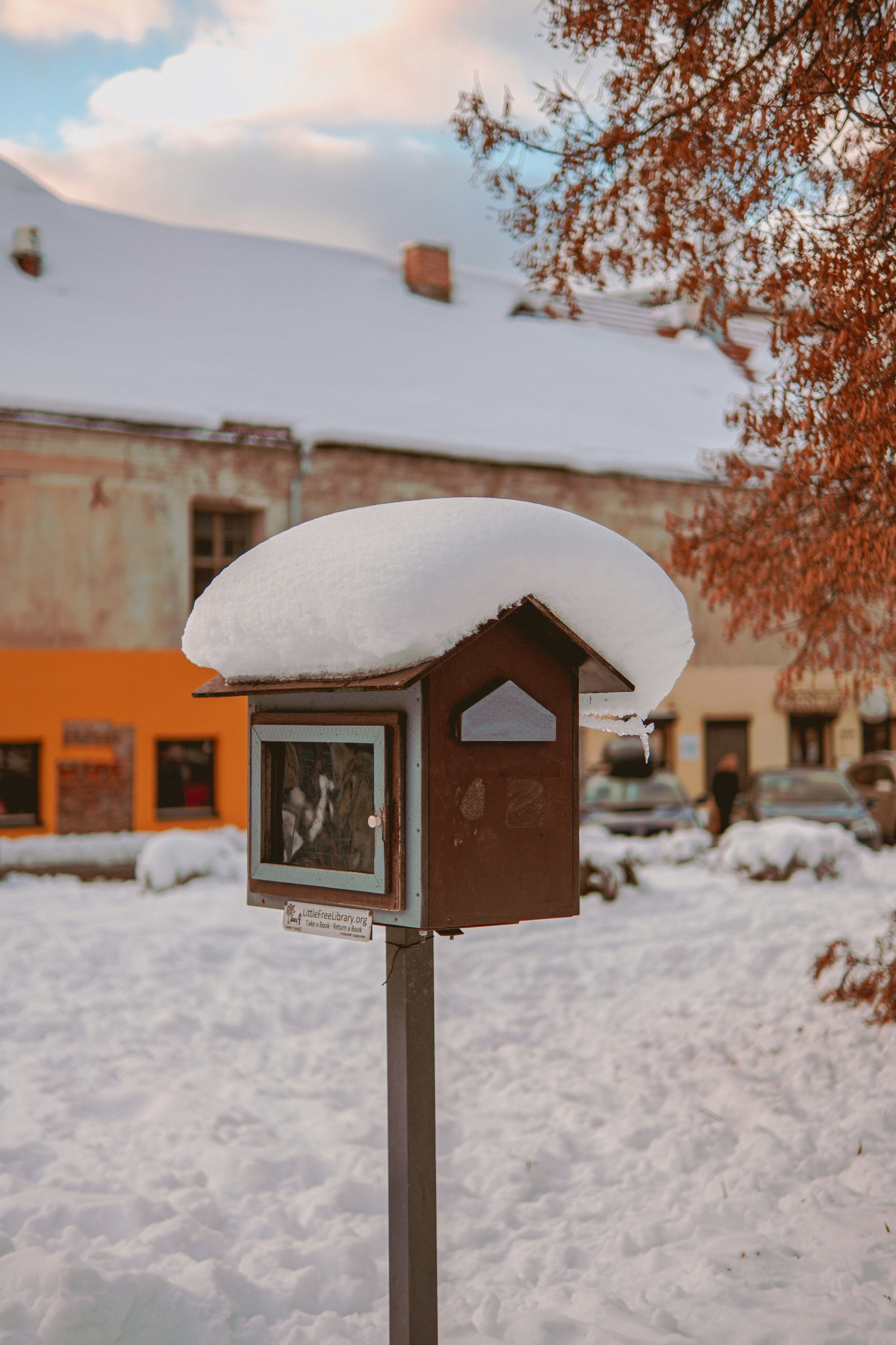 black and white mail box on snow covered ground during daytime