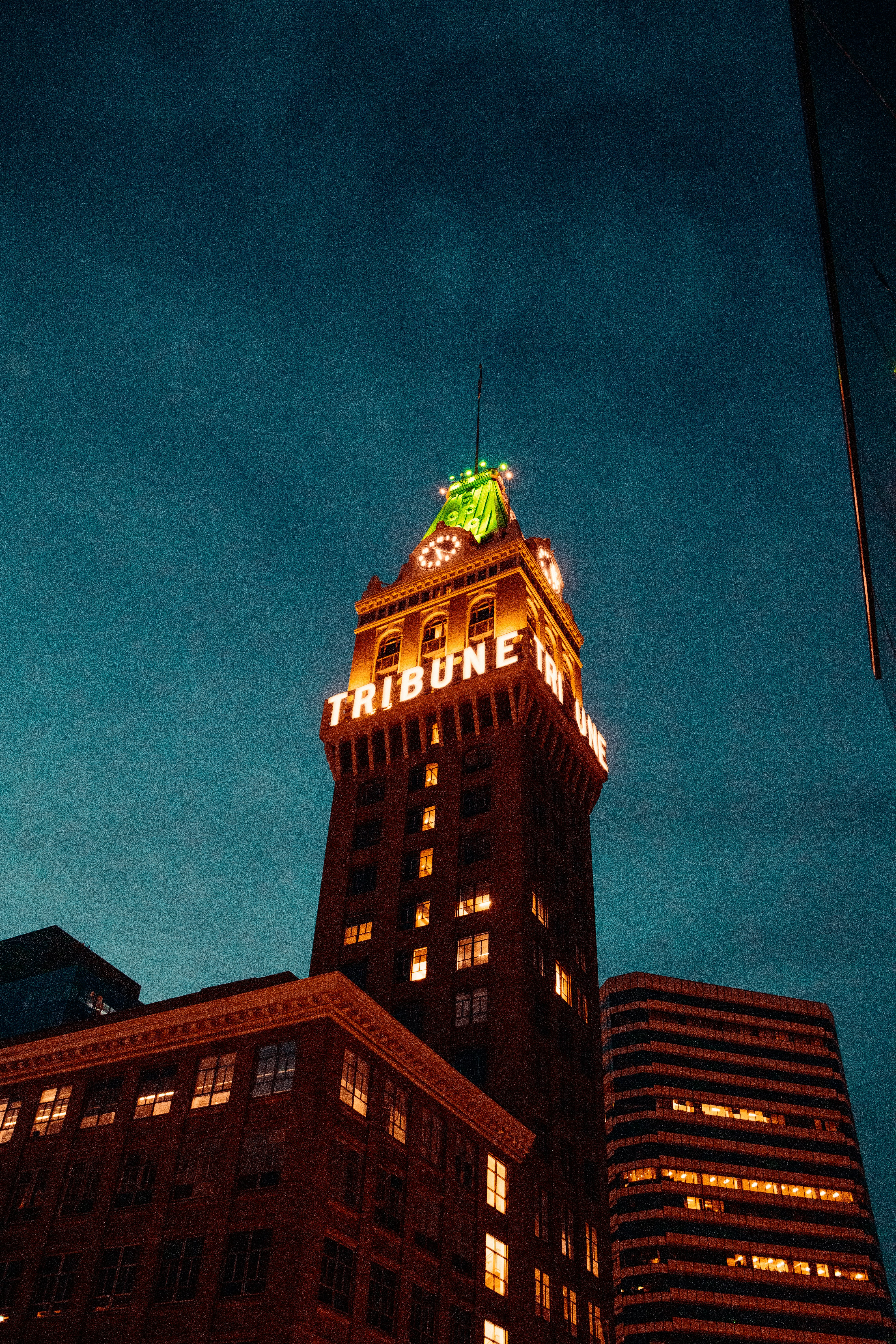 Tribune Tower at Dusk: Neon Crown and Brick Facade