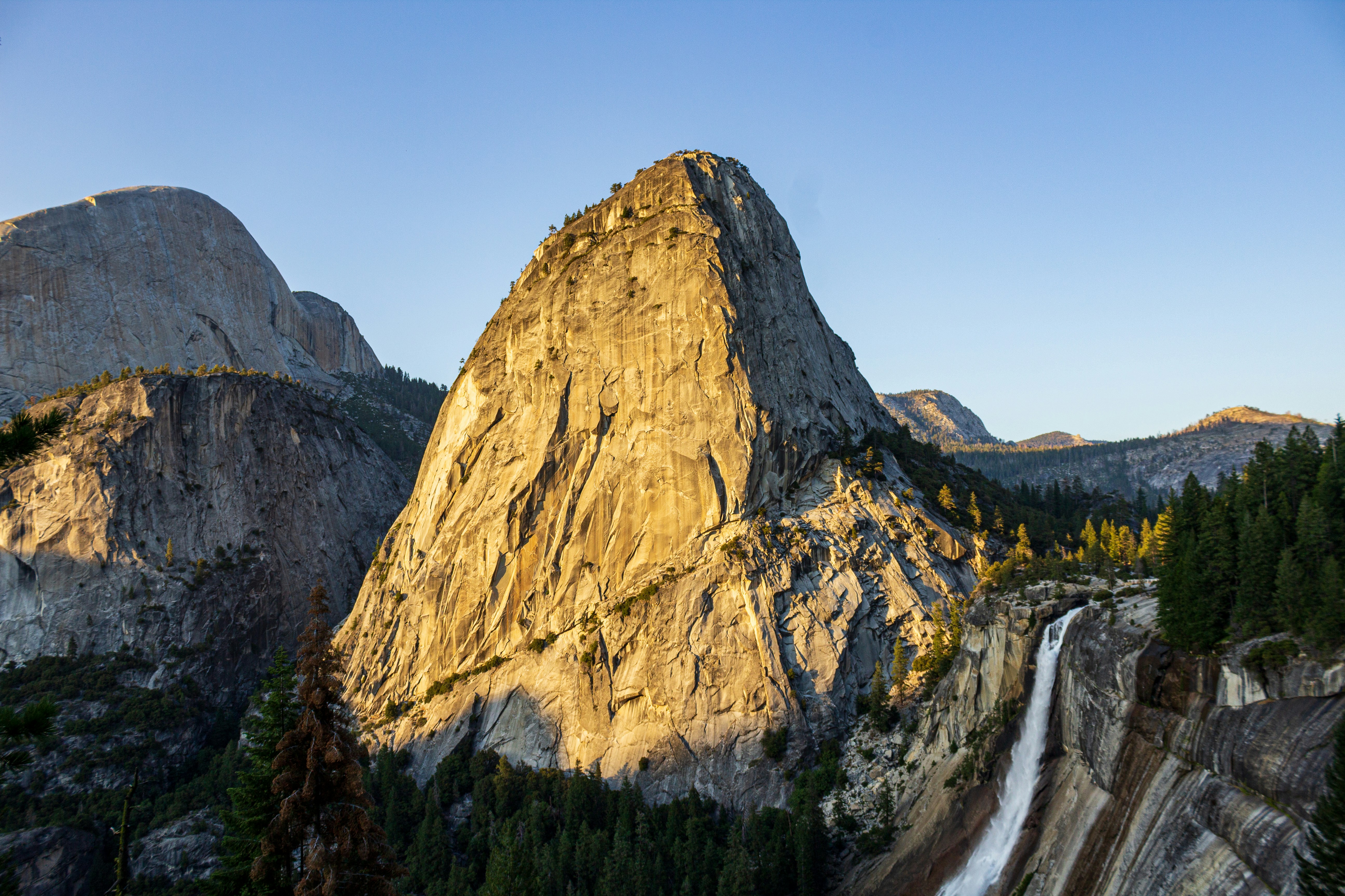 brown rocky mountain under blue sky during daytime