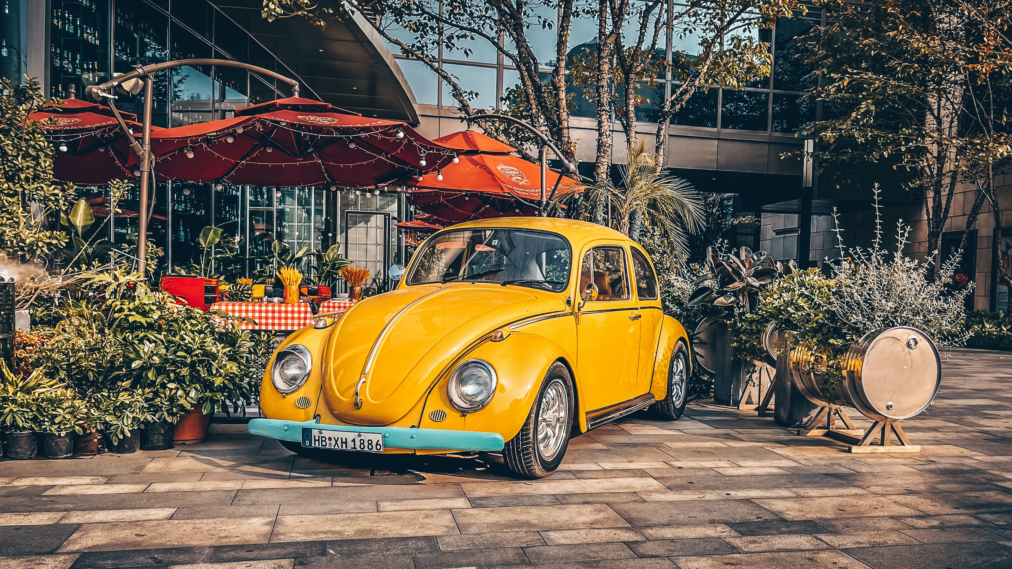 Sunny yellow Beetle at a Modern Courtyard Café