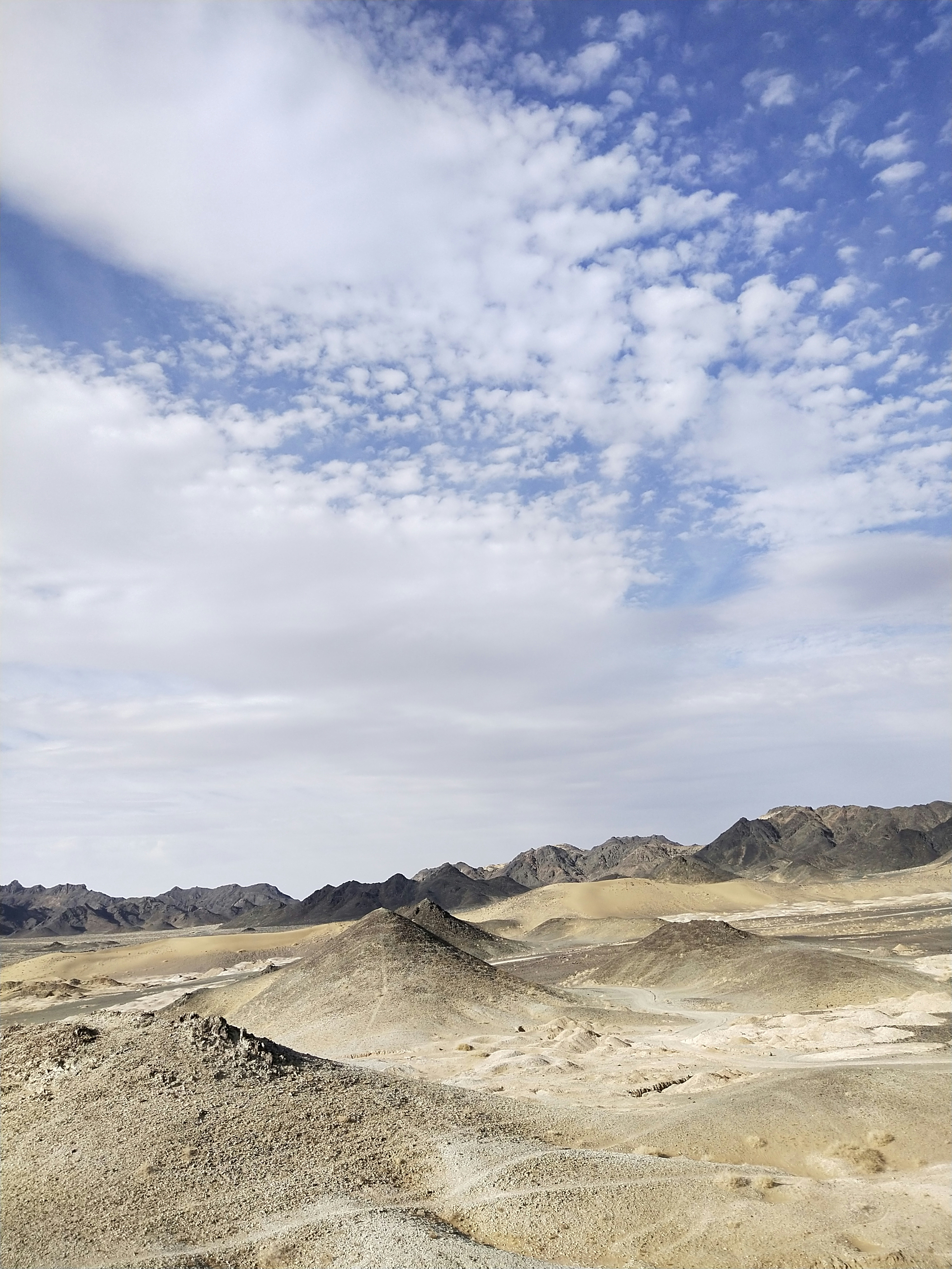Brown mountain under blue sky and white clouds during daytime photo ...
