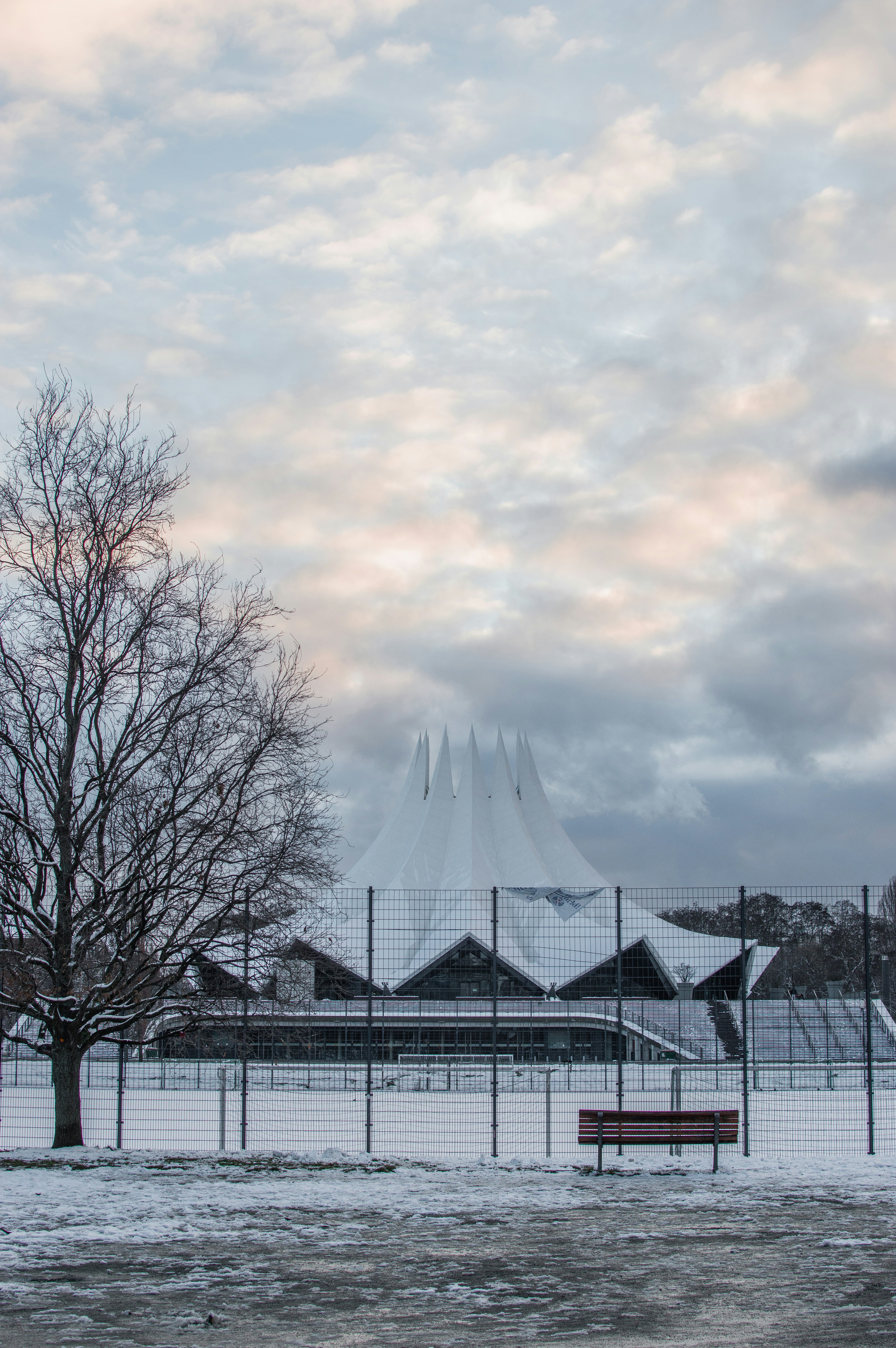 Snowbound Sails: A Sail-Topped Pavilion Rises Over a Frozen Park