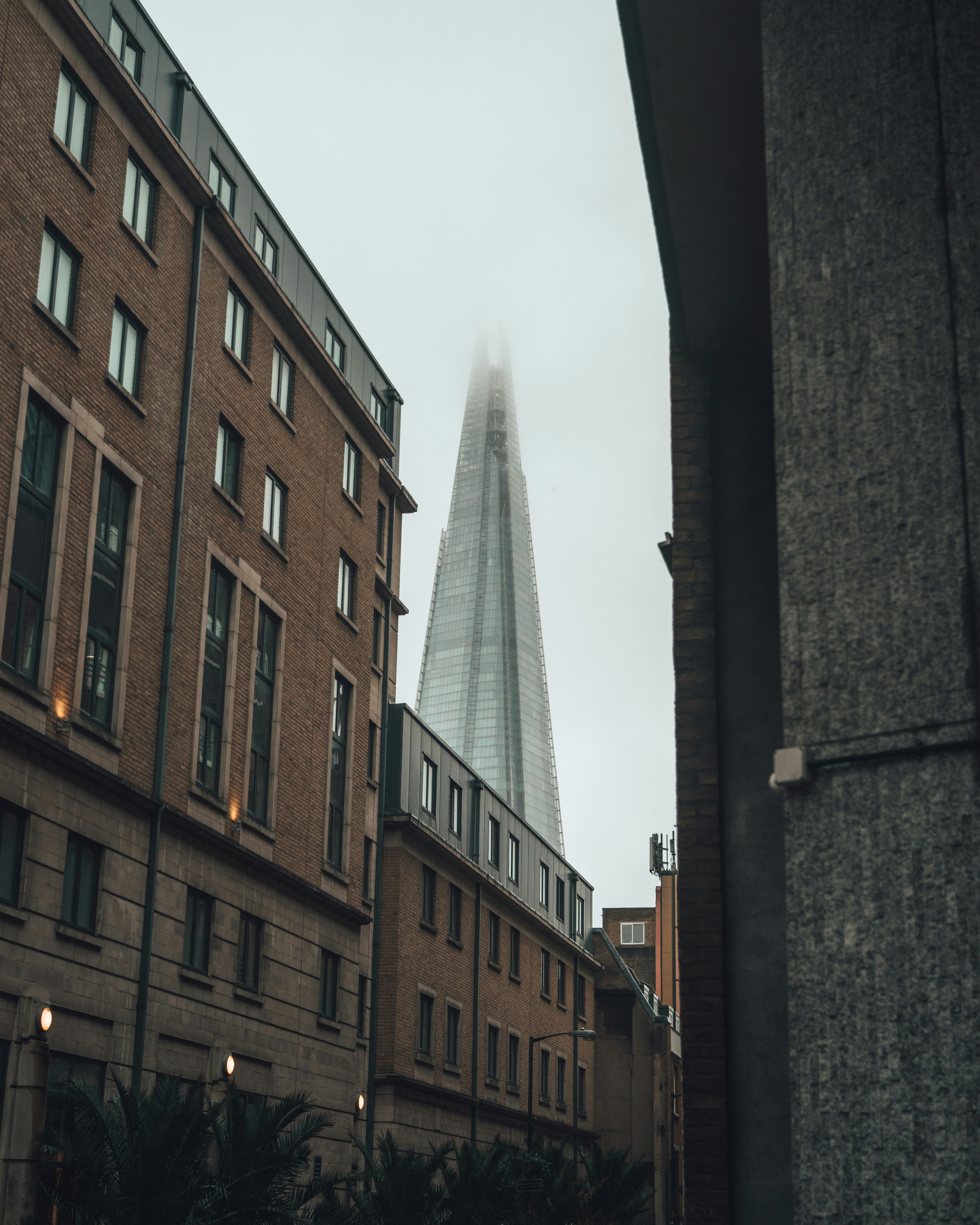 Veiled Spire Over a Narrow London Alley
