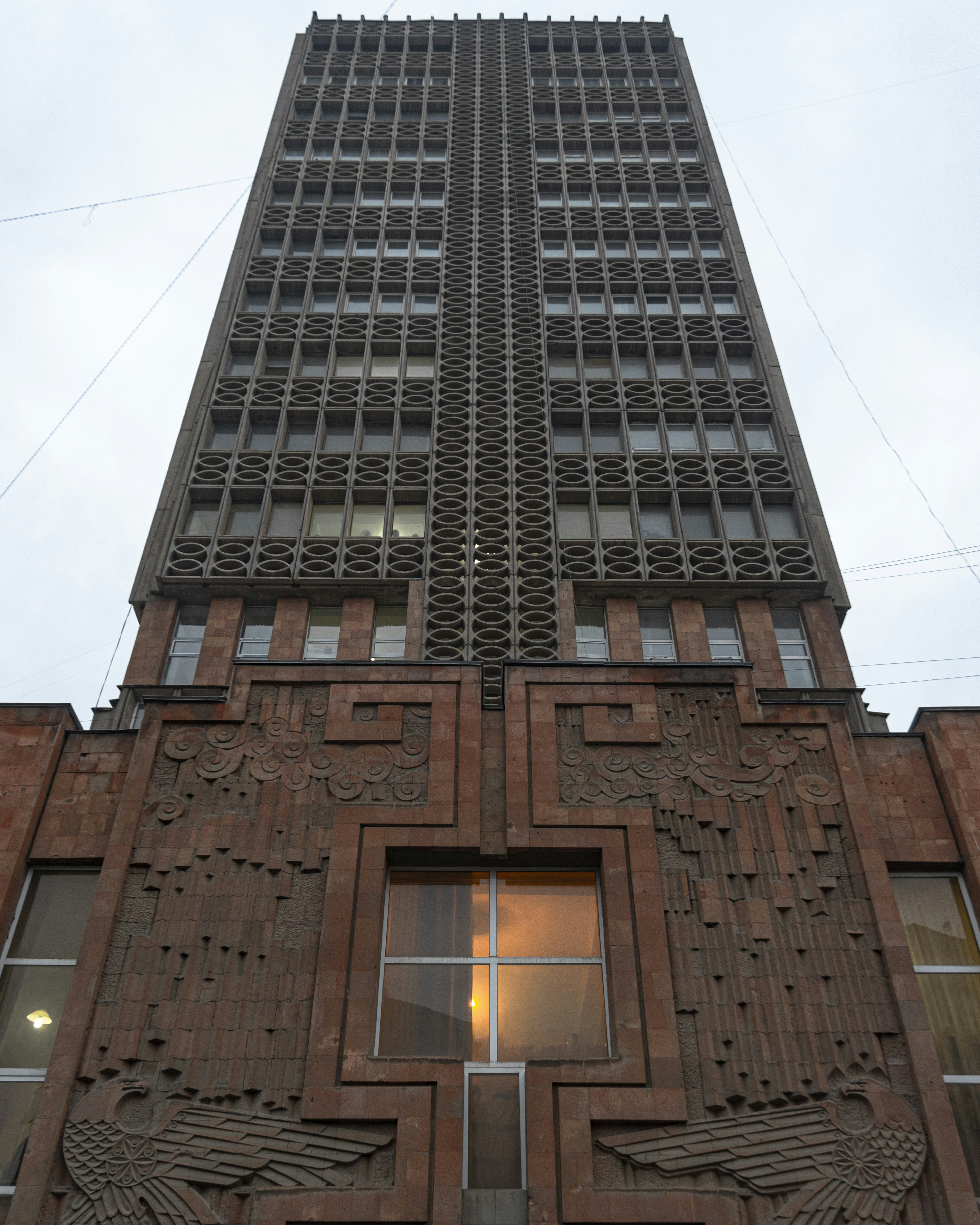 Glow Through the Geometric Facade: A Brick-Tiered Art Deco Tower