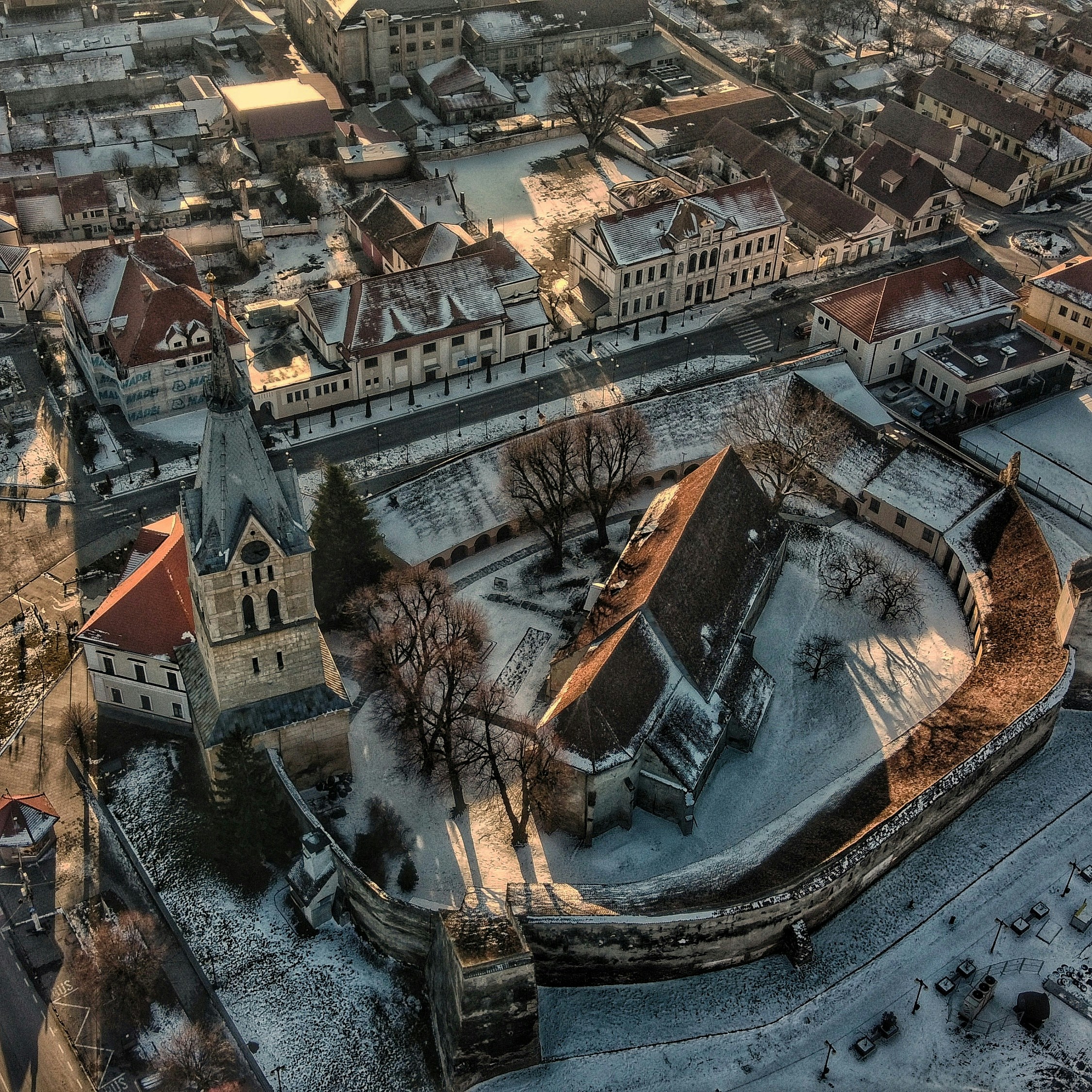 Snowbound Bastion: Aerial View of Medieval Fortifications at Dusk