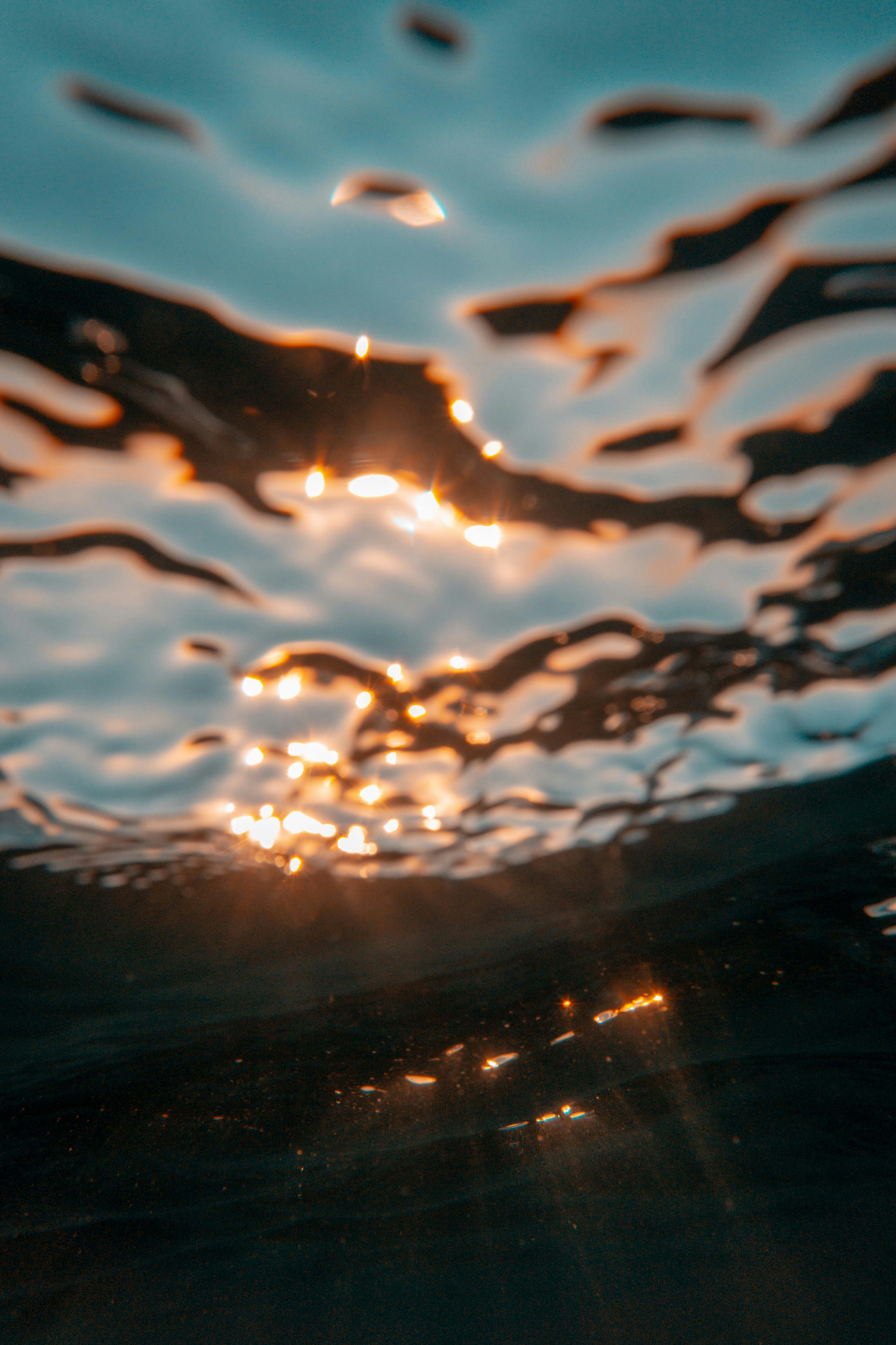 Rippling Reflections: A Dance of Light Beneath the Surface