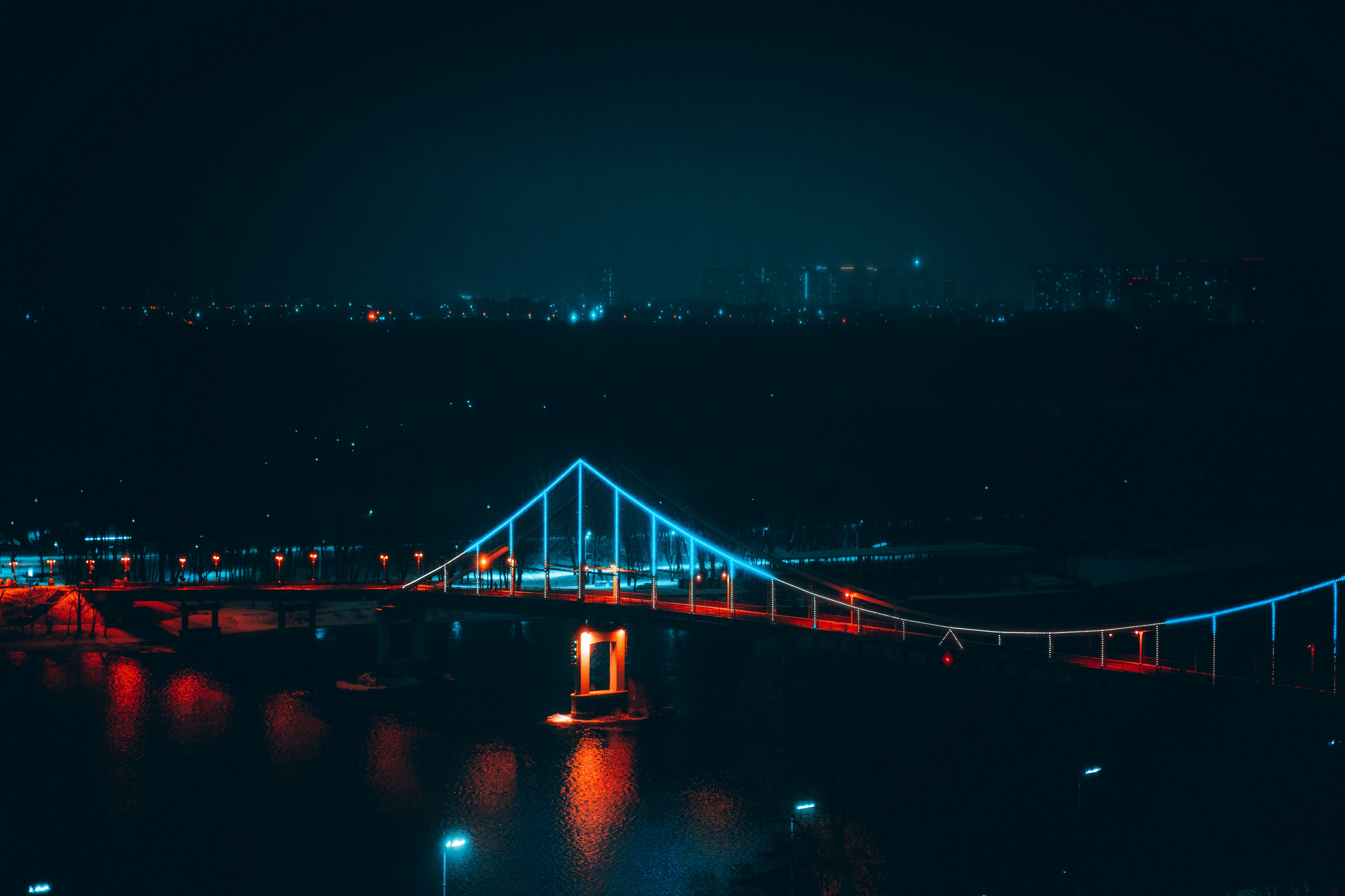 Neon Span Over Dark Water: A Quiet City at Night