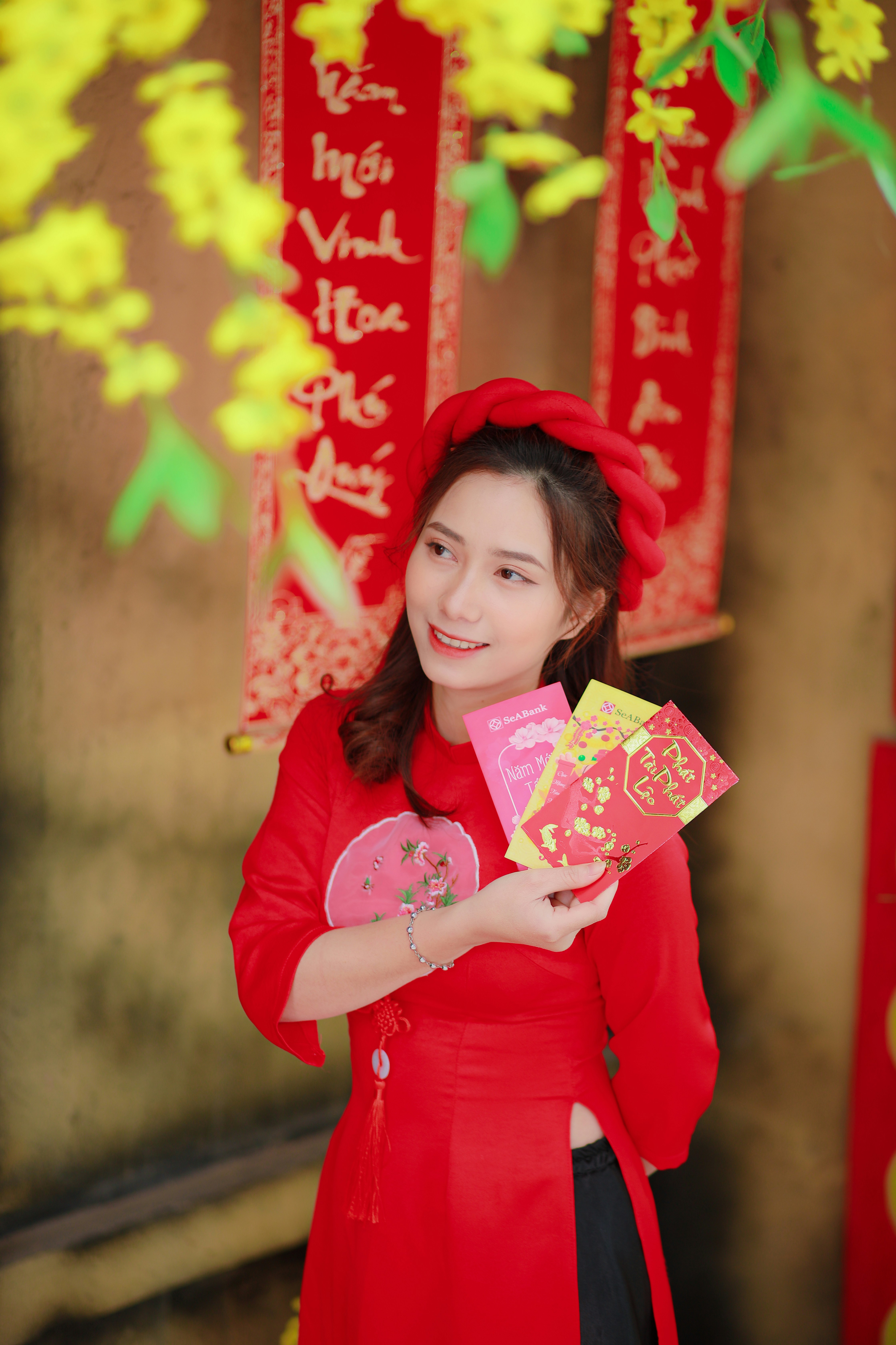 Red Envelope Moment: A Tet Portrait Amid Velvet Red Banners
