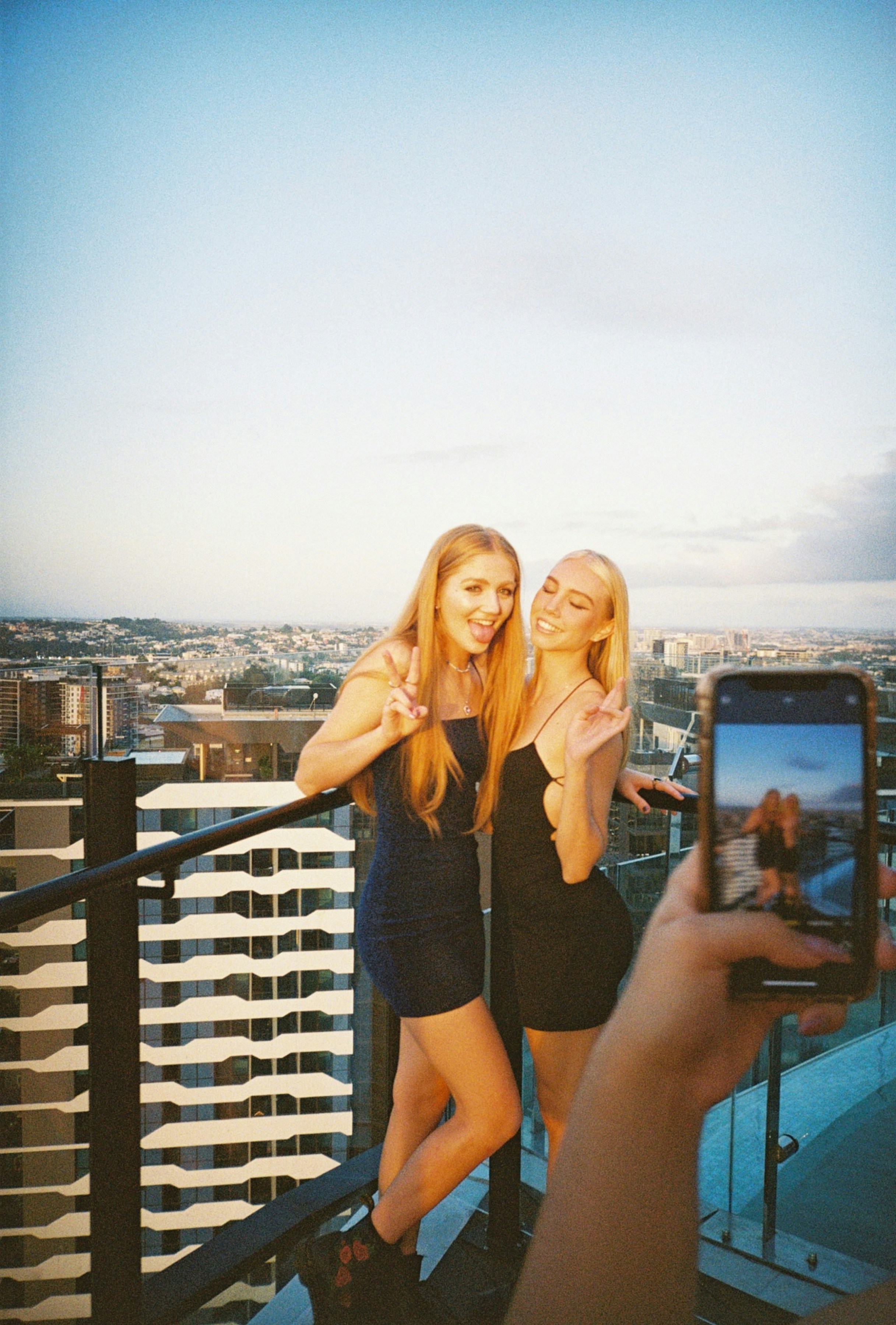 2 women standing beside railings during daytime photo – Free Film ...
