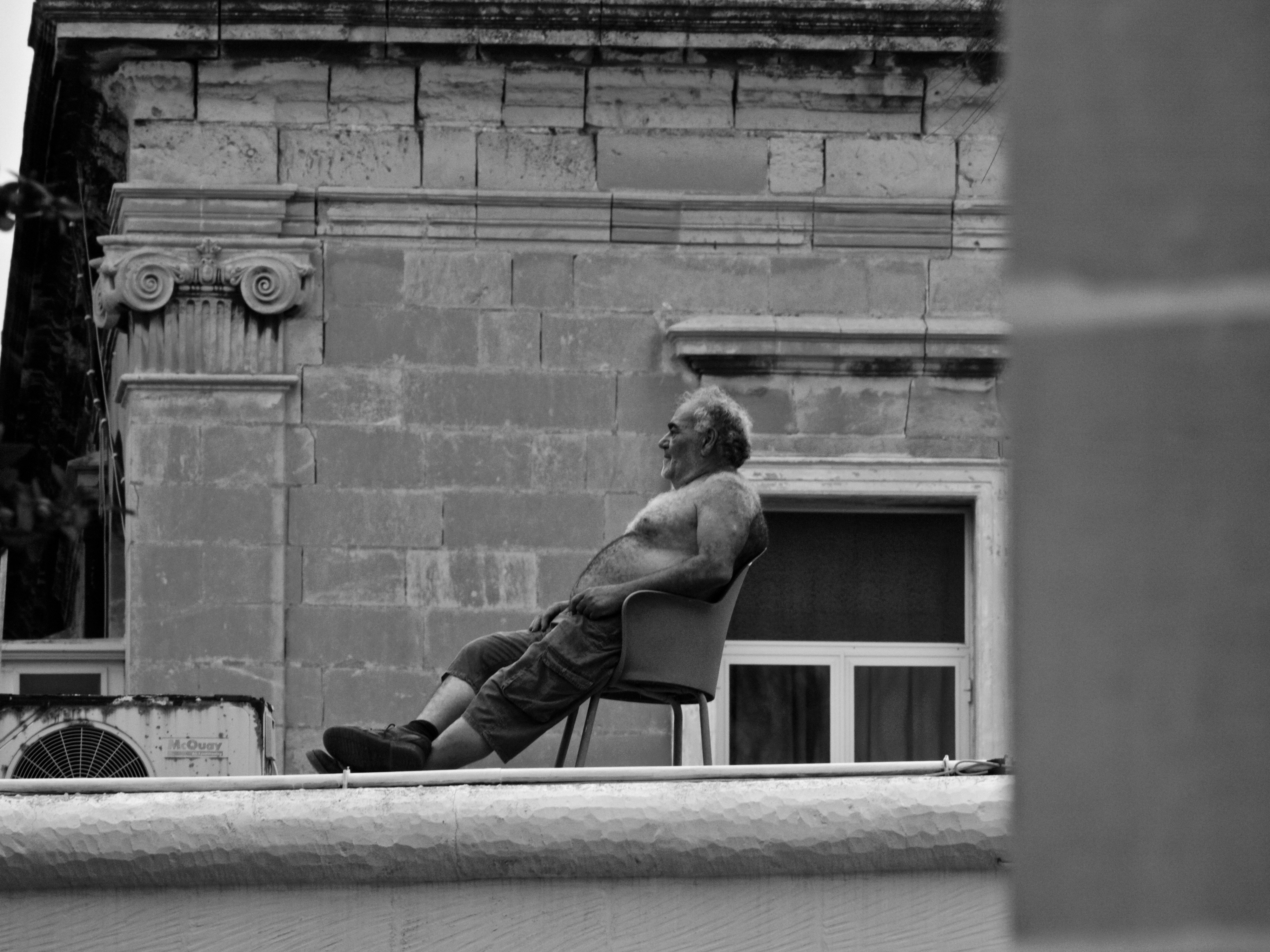 Solitary Recline: A Quiet Moment Above the City
