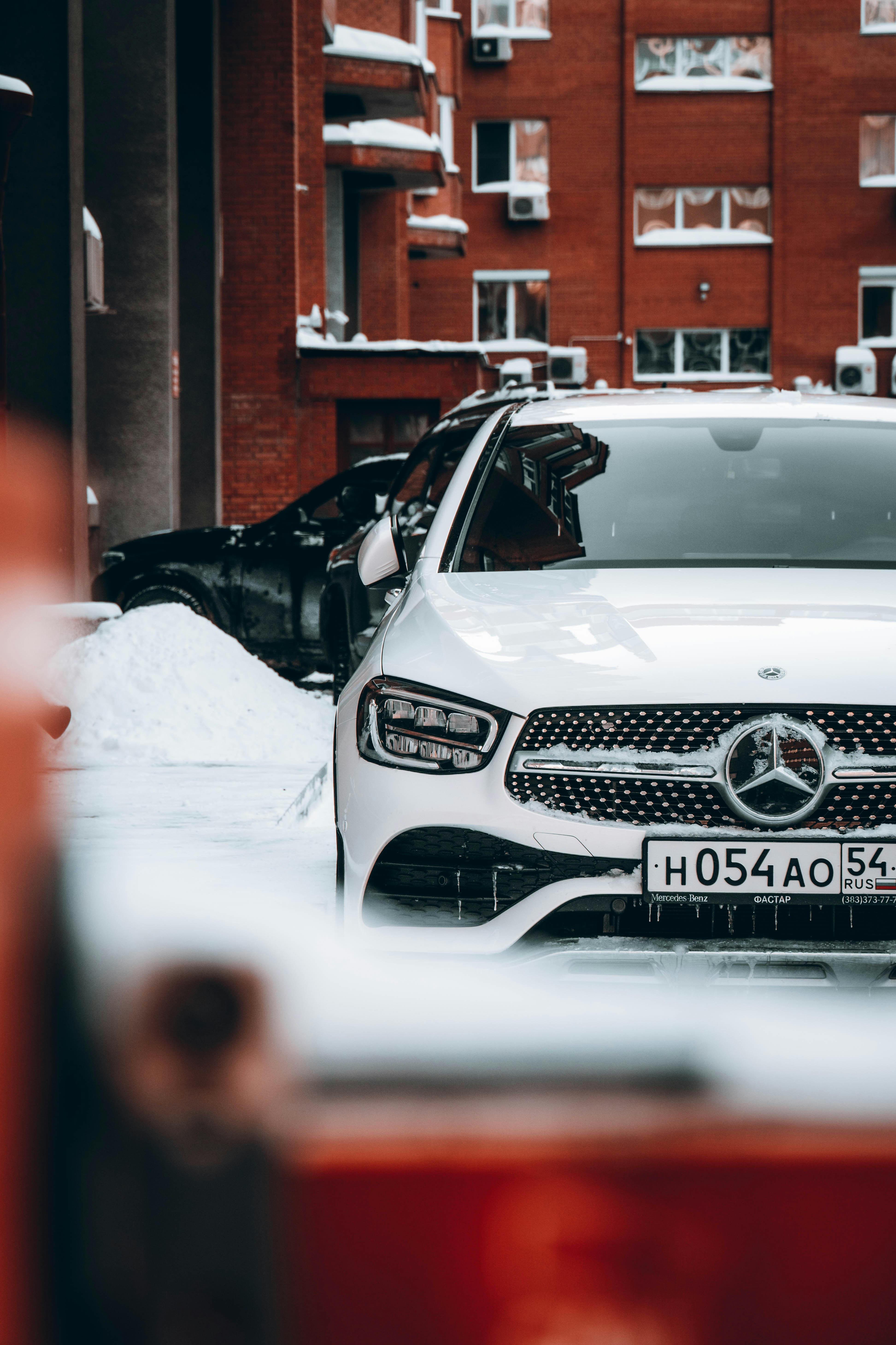 White mercedes benz car on snow covered road during daytime photo ...