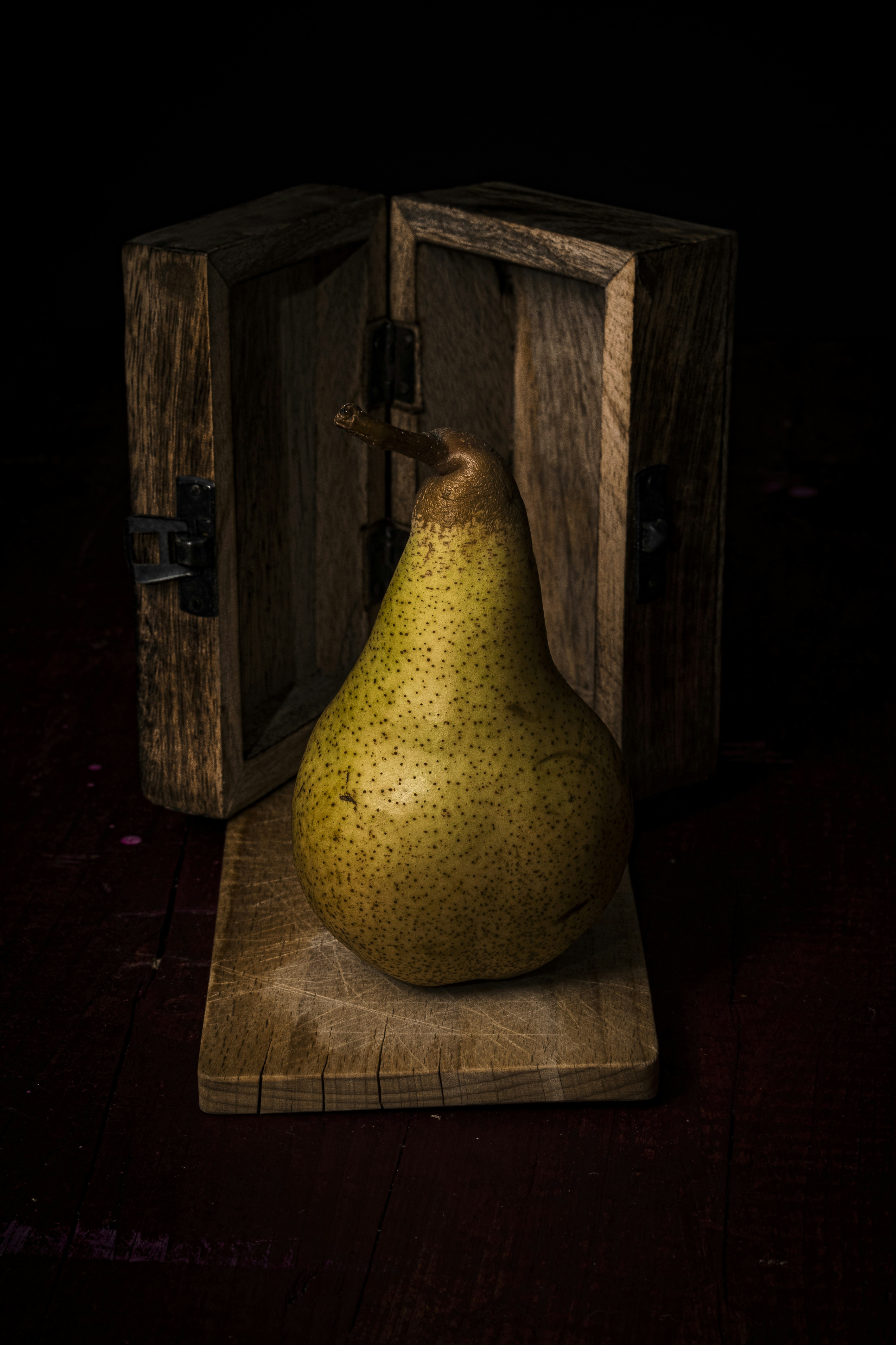 gold bauble on brown wooden table