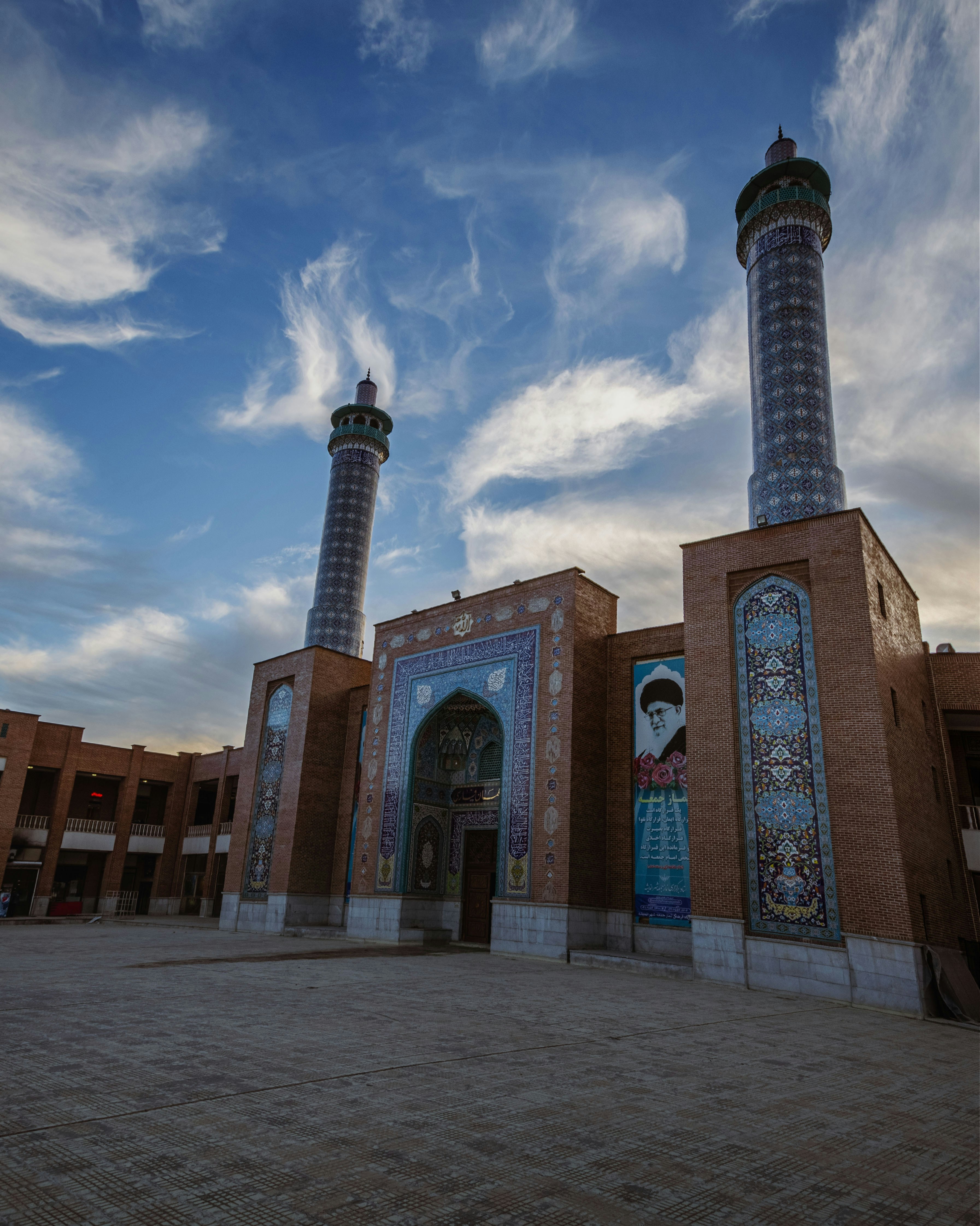Blue-Tiled Gateway Framed by Twin Minarets in Daylight