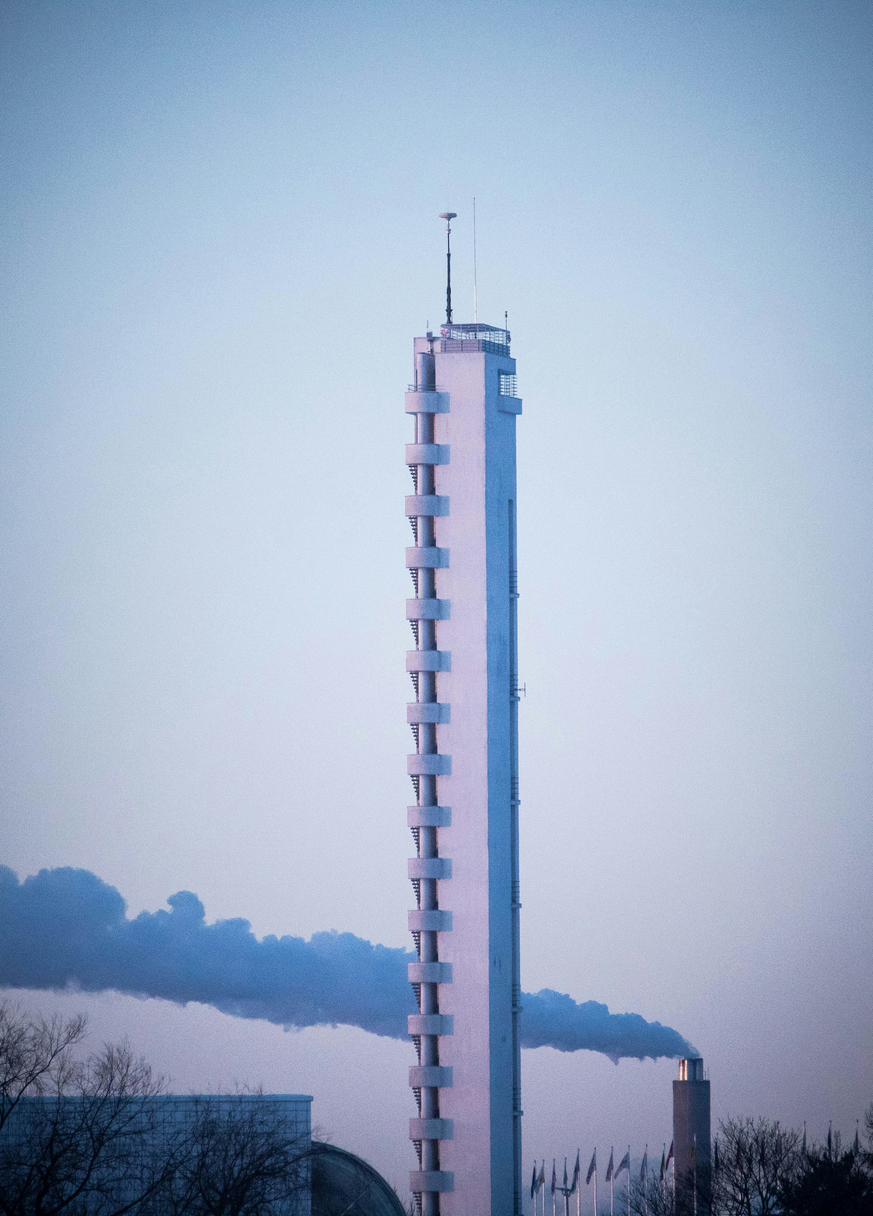 Vertical Chimera: A Power Plant Tower Piercing the Sky