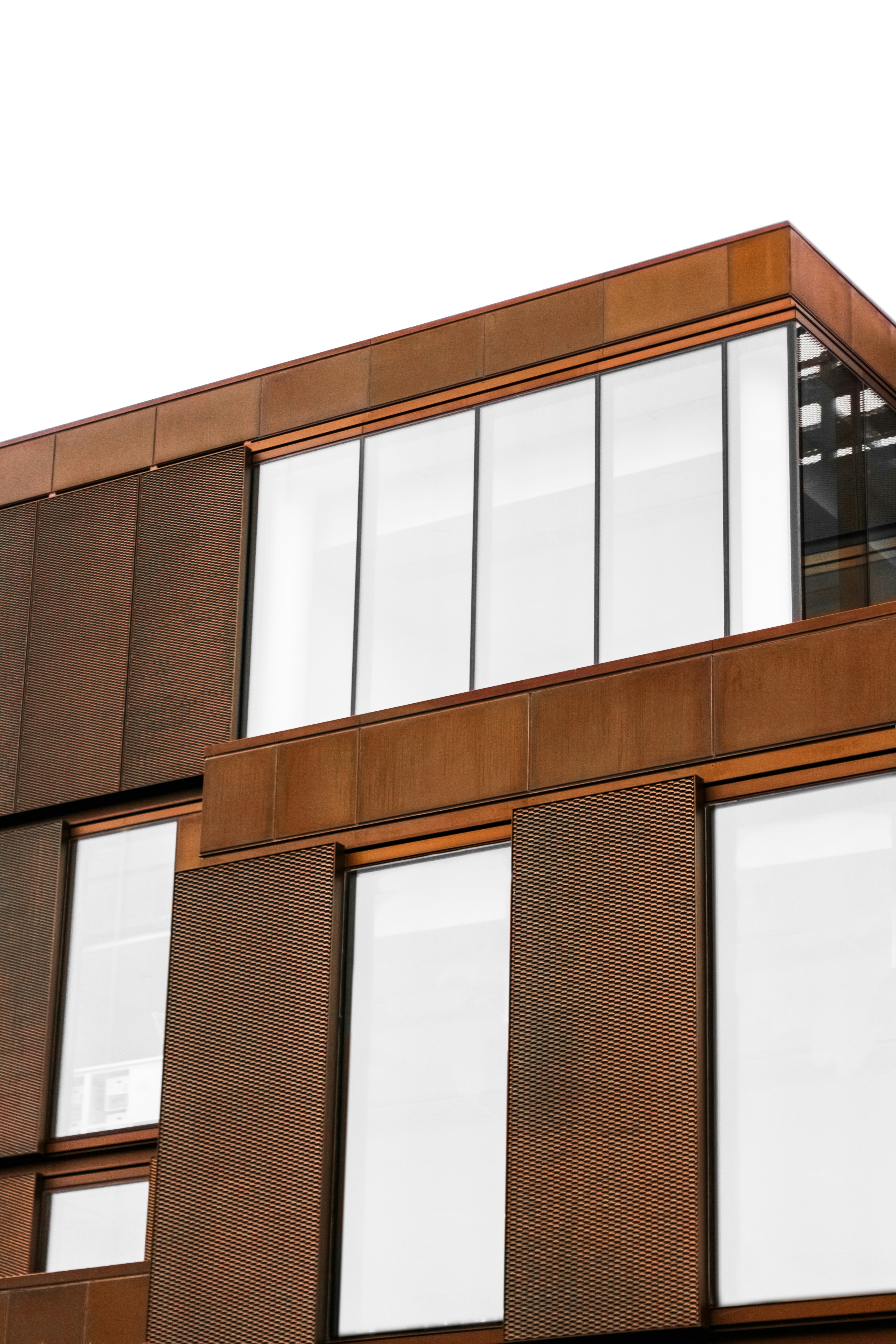 Rust-Lined Glass: A Geometric Modernist Facade