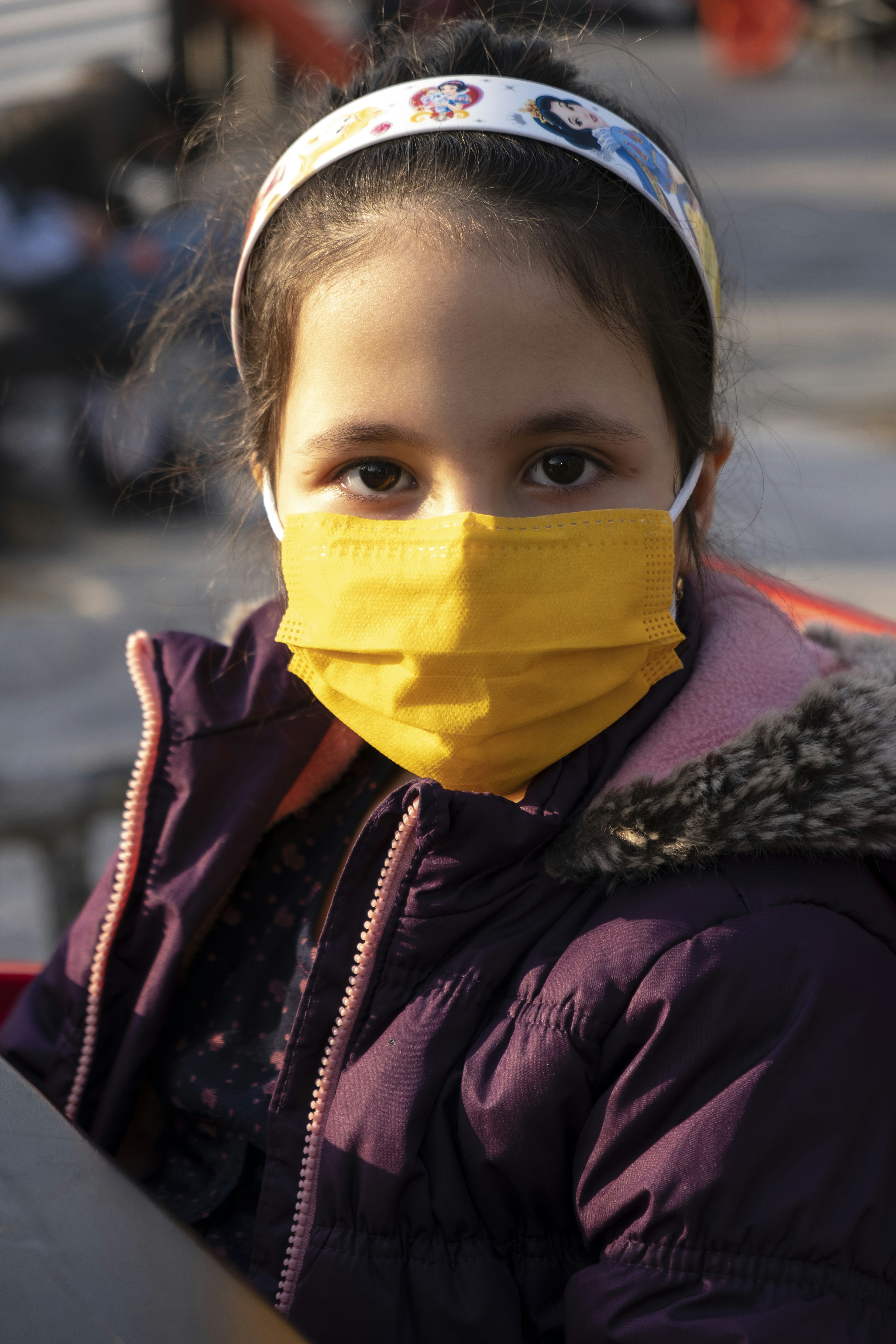 Masked Gaze: Street Portrait in a Purple Winter Coat